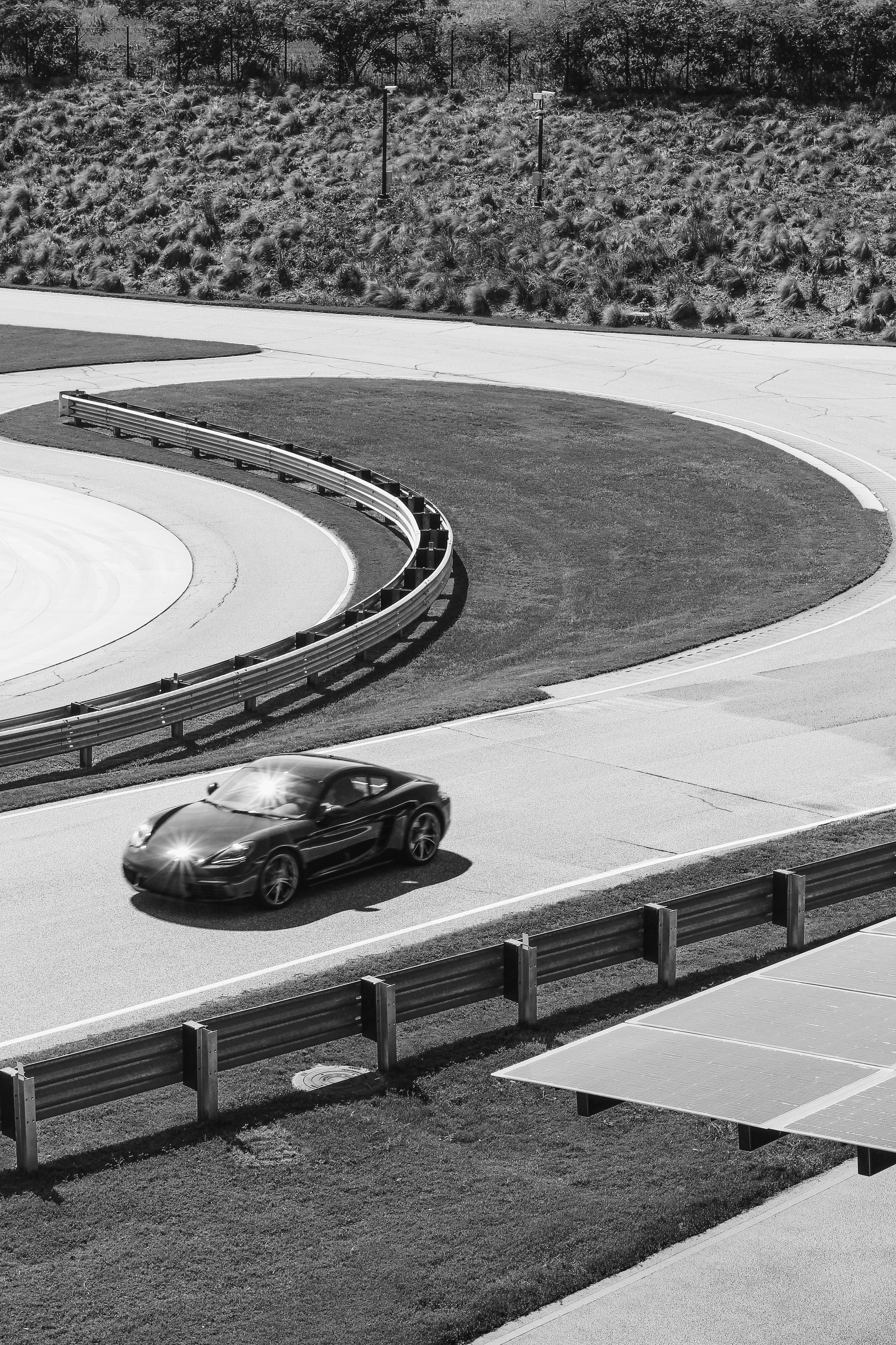 Sports Car on Circuit in Black and White · Free Stock Photo