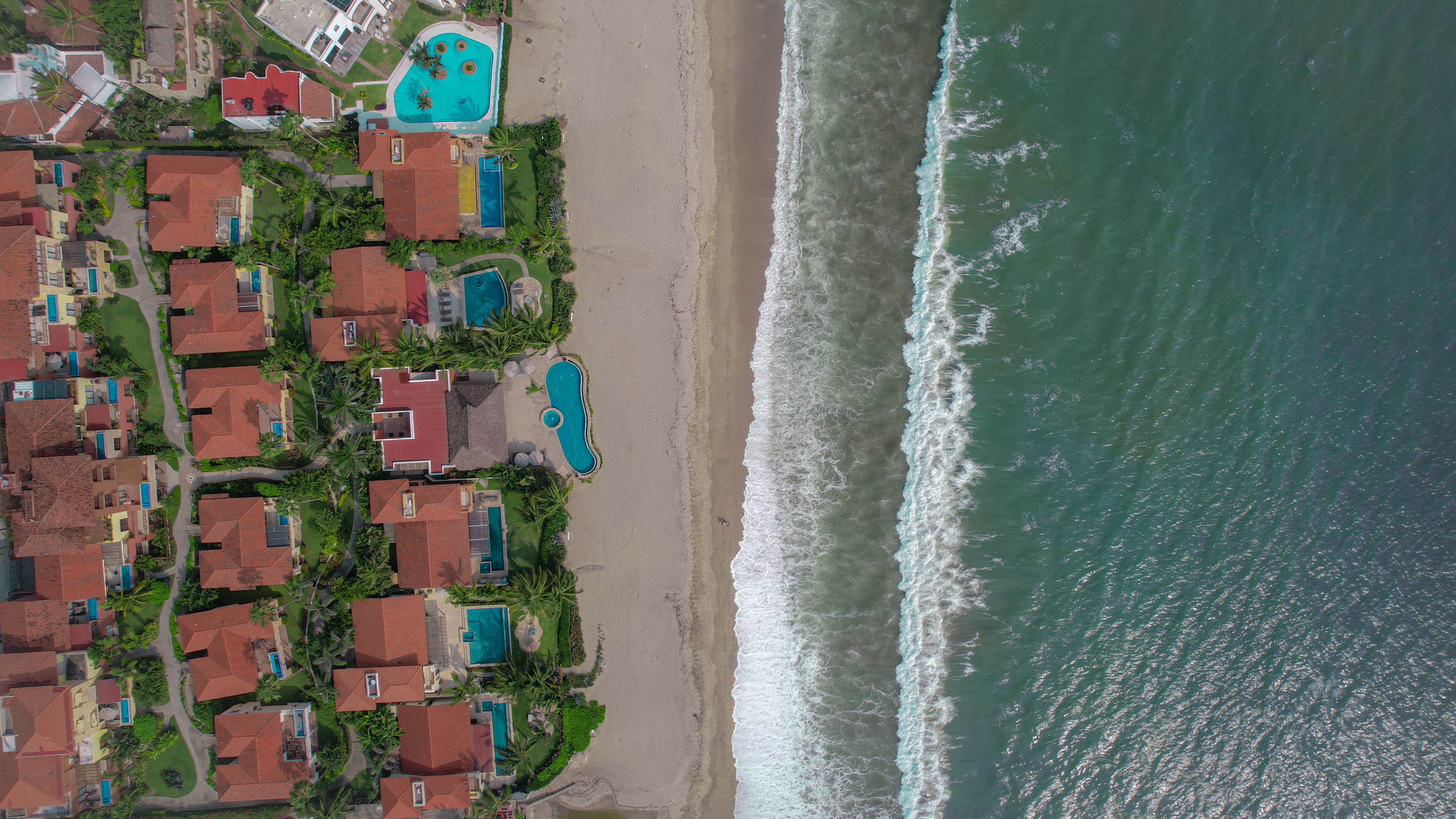 An aerial view of a beach and houses · Free Stock Photo