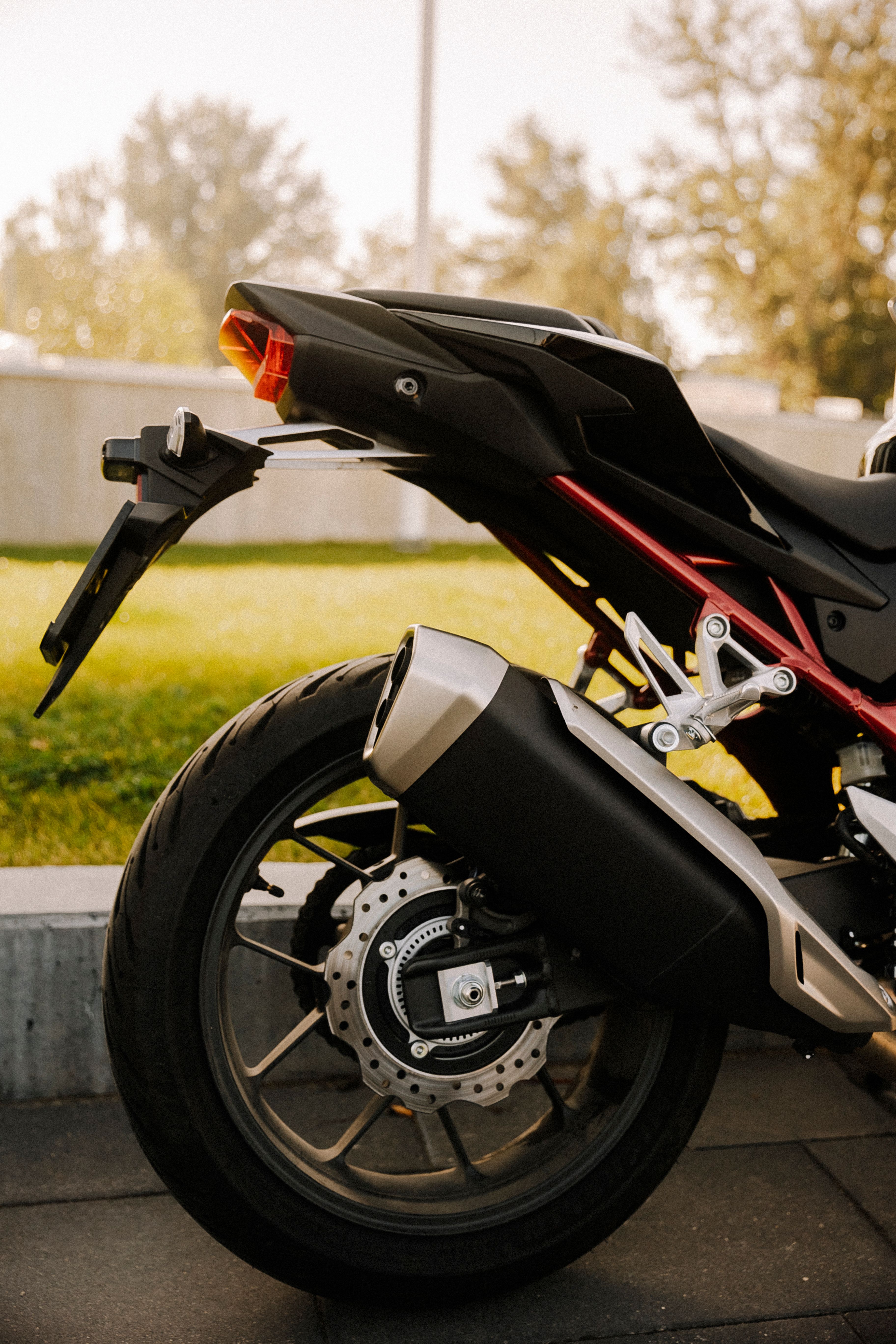 A close up of a motorcycle parked on the side of the road · Free Stock ...