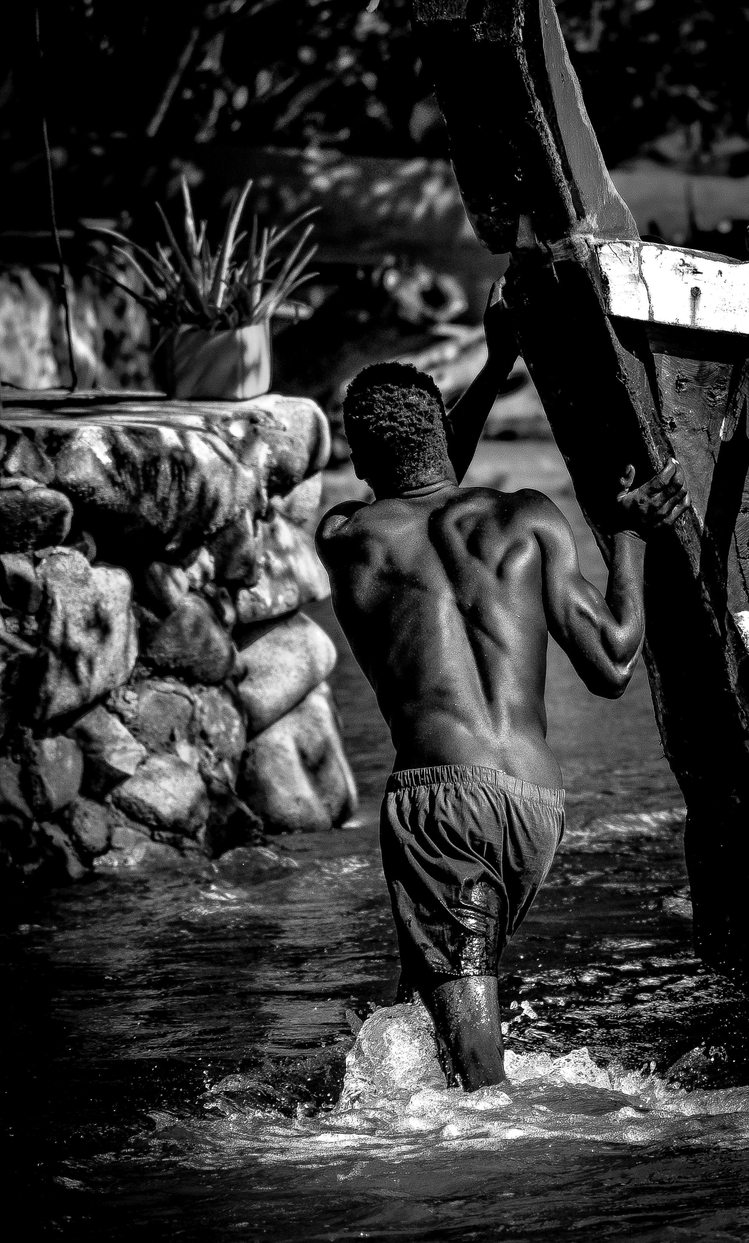 Man Pulls Boat to Shore · Free Stock Photo