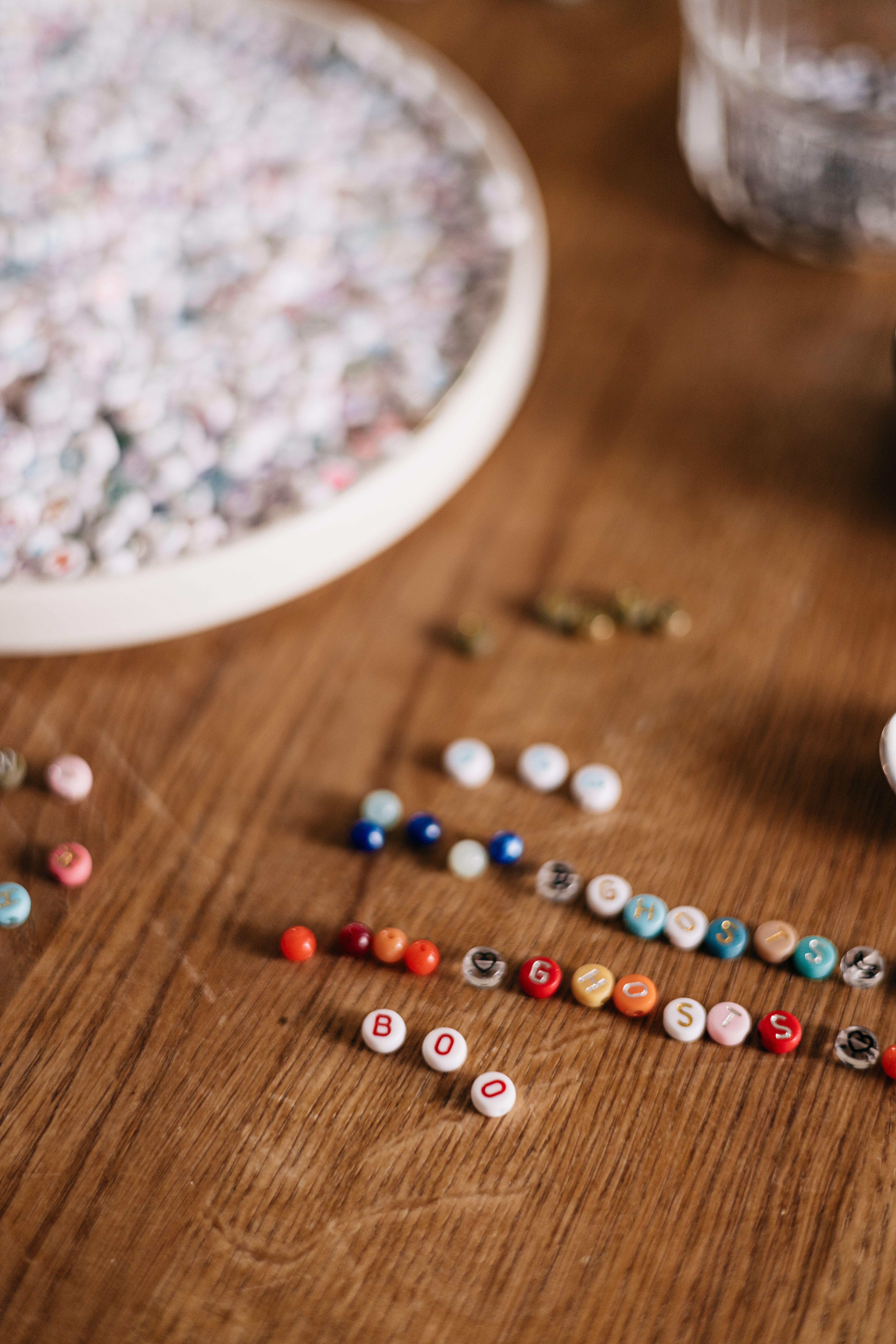 Various Beads on a Wooden Table · Free Stock Photo