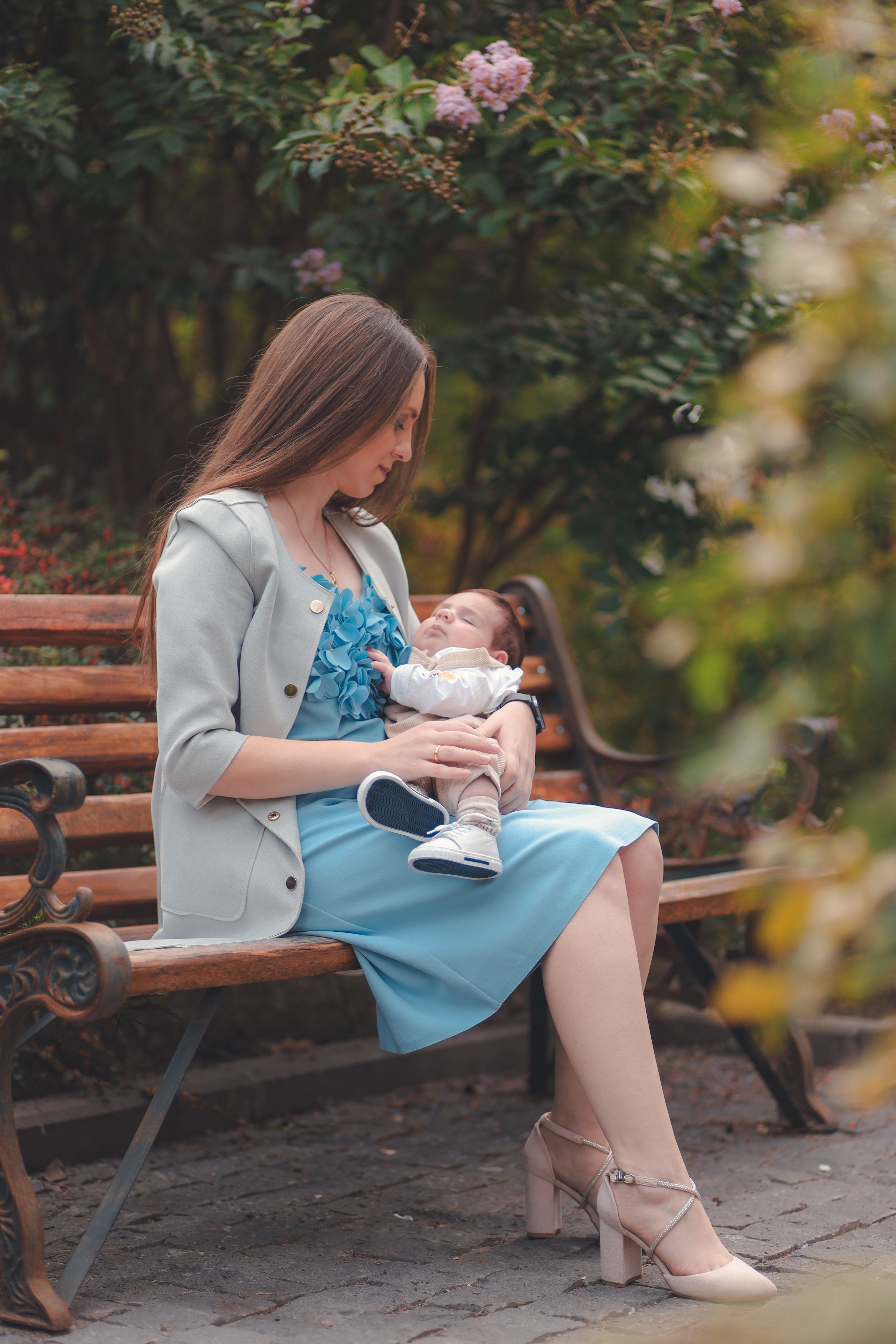 Mother Sitting with Baby on Lap in Park · Free Stock Photo