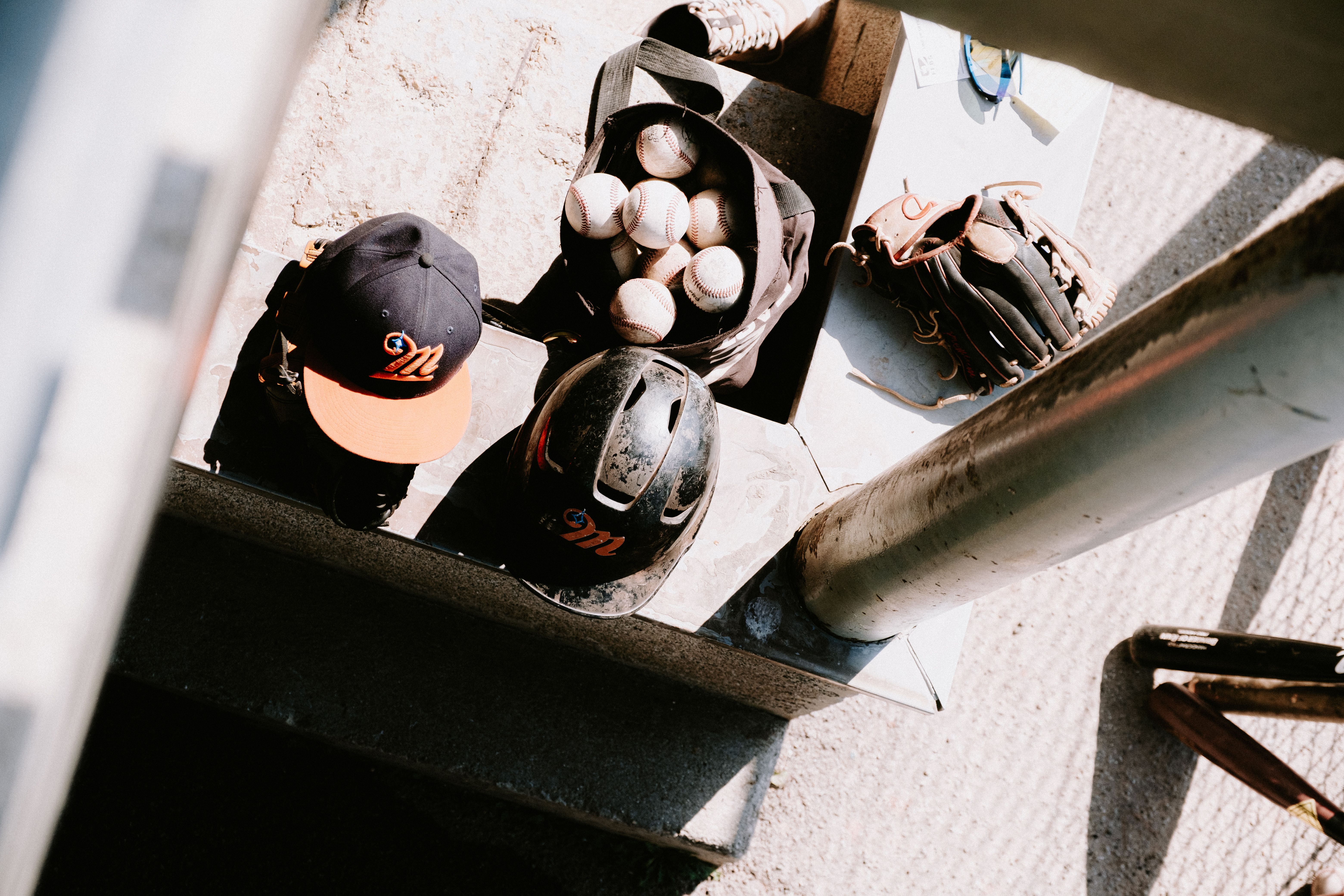 Cap, Helmet, Gloves and Bag with Balls · Free Stock Photo