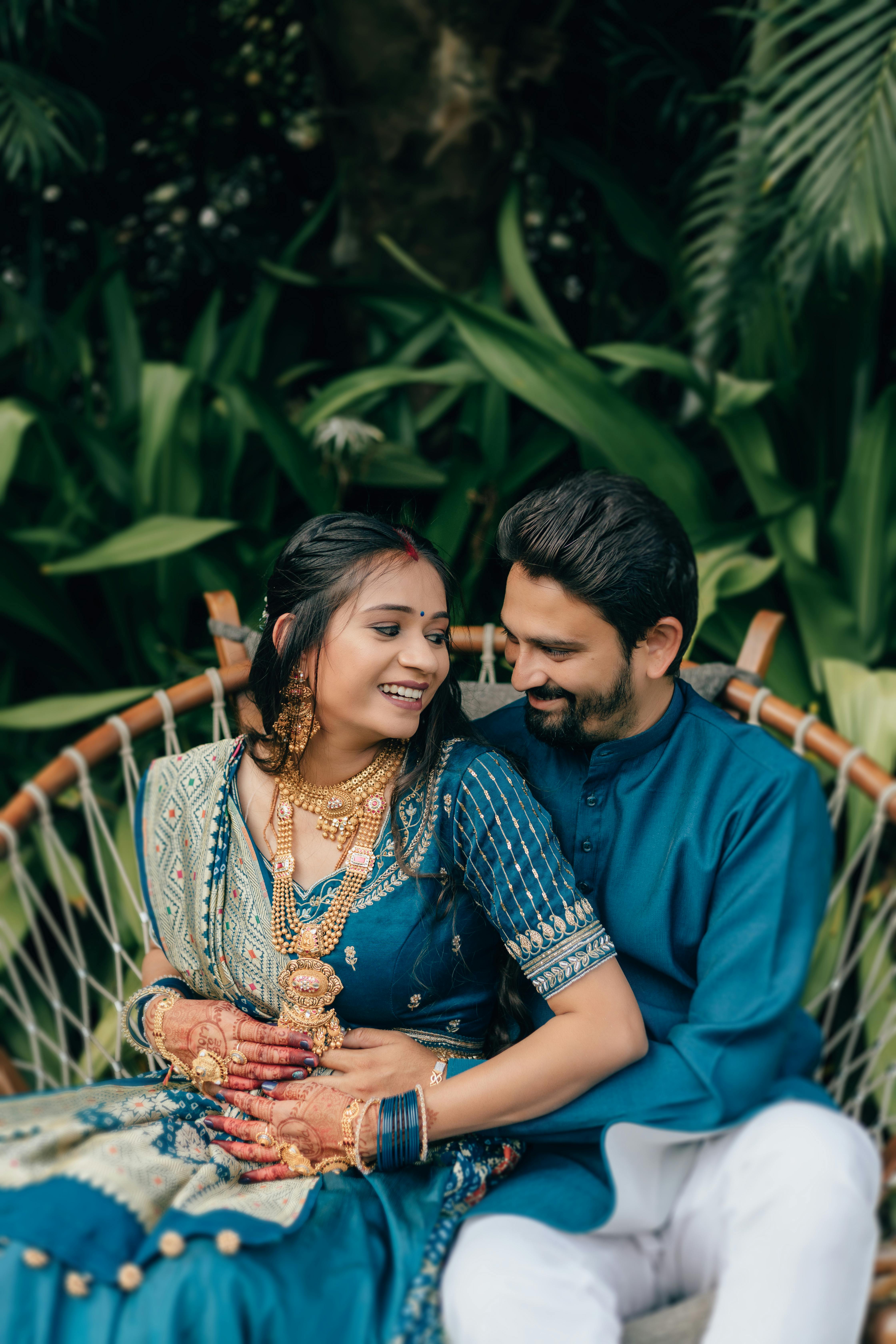 Bride and Groom in Traditional Indian Clothing Embracing in a Rattan ...