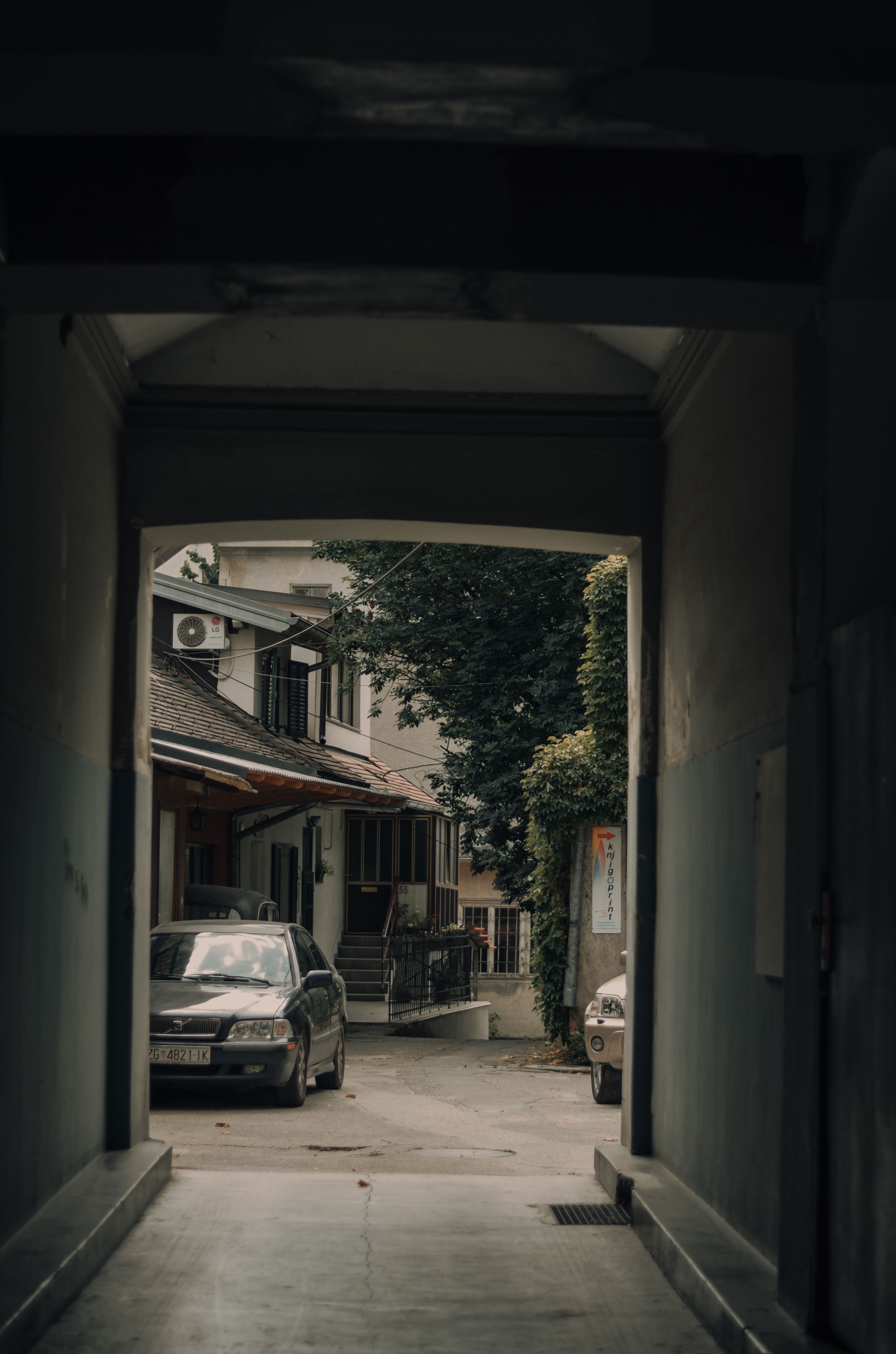 Car Driving in a Passage Through a Building · Free Stock Photo