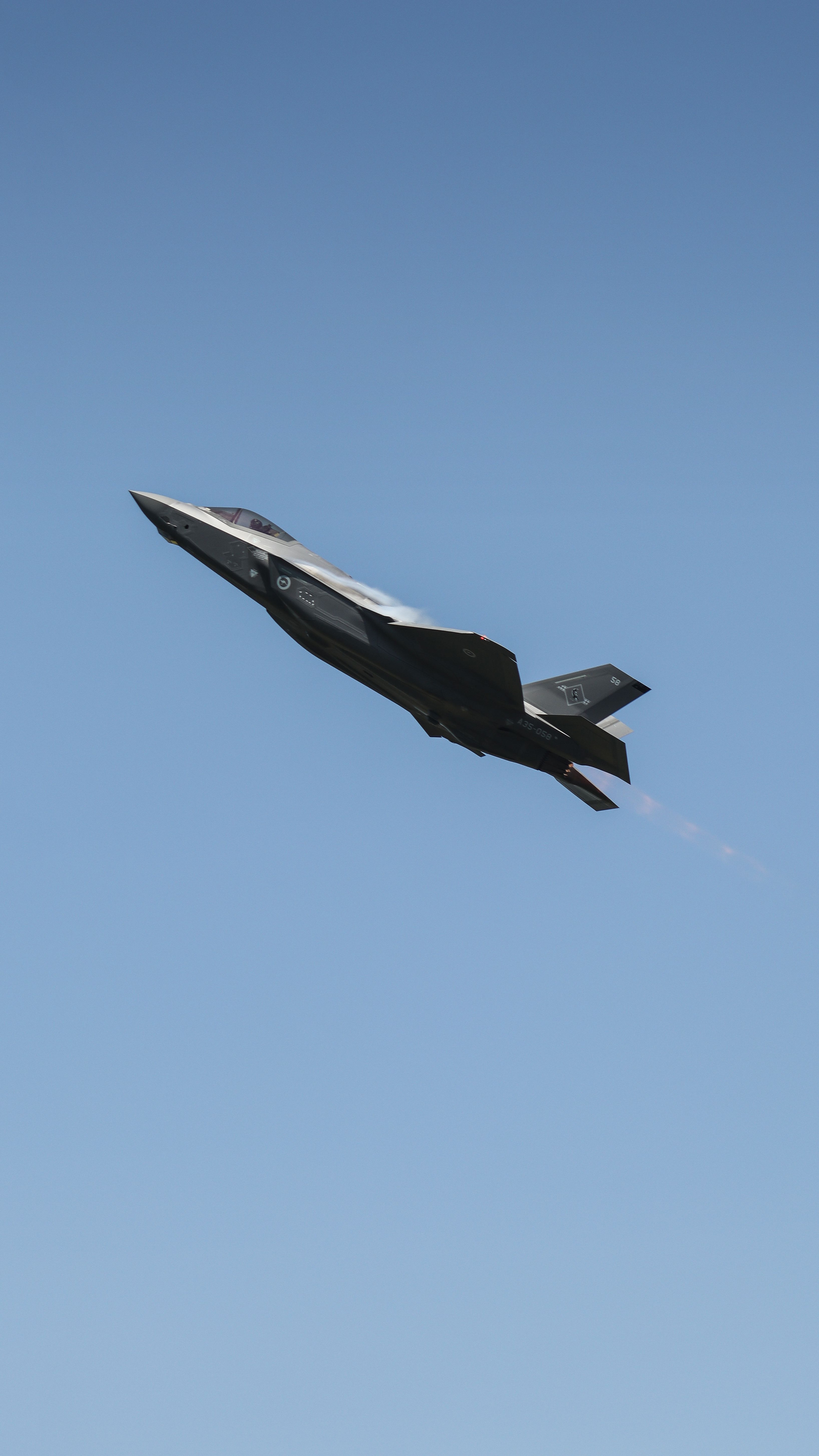 Black Fighter Jet Near White Clouds · Free Stock Photo