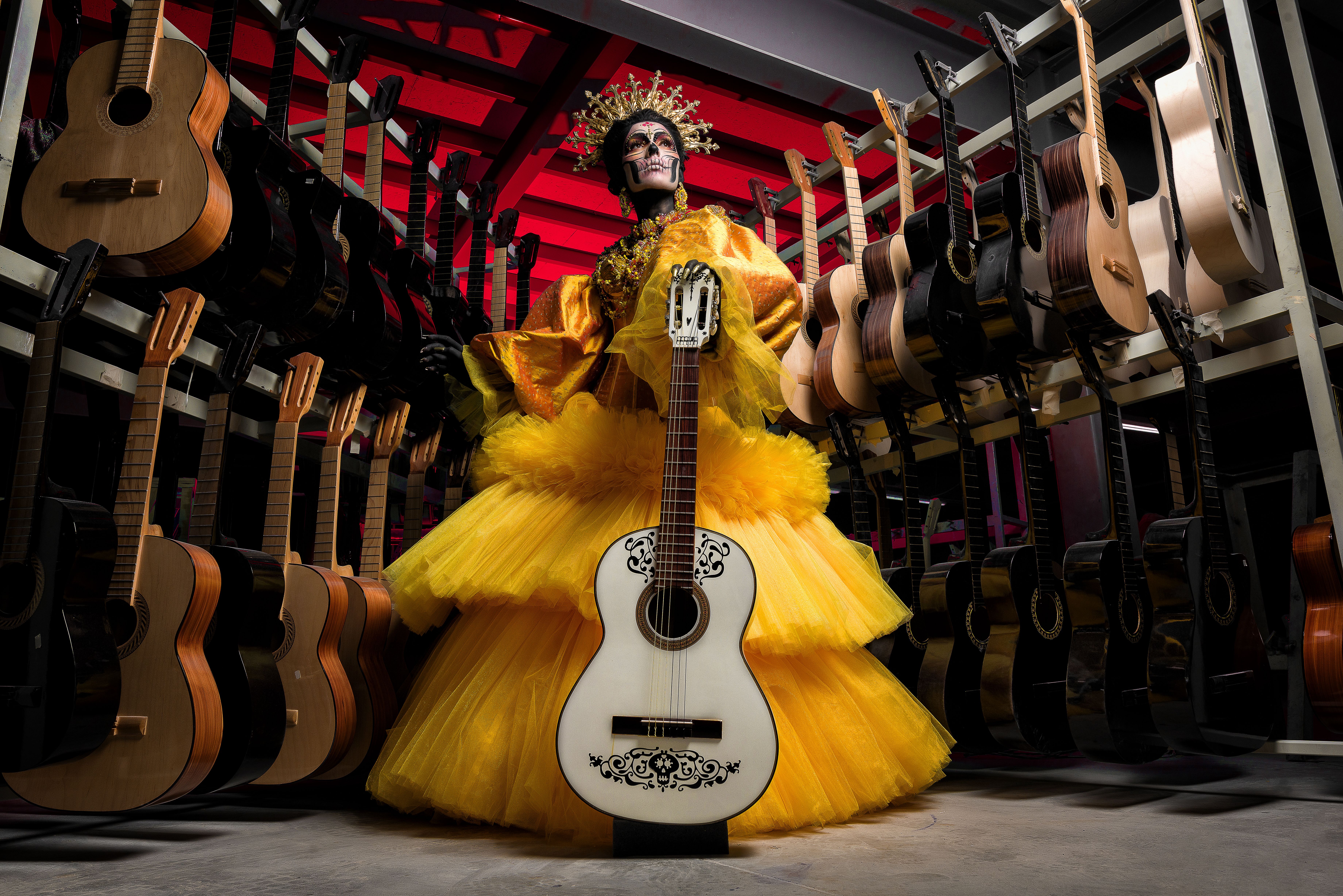 Woman Wearing a Skull Makeup Standing with a Guitar in a Music Store ...