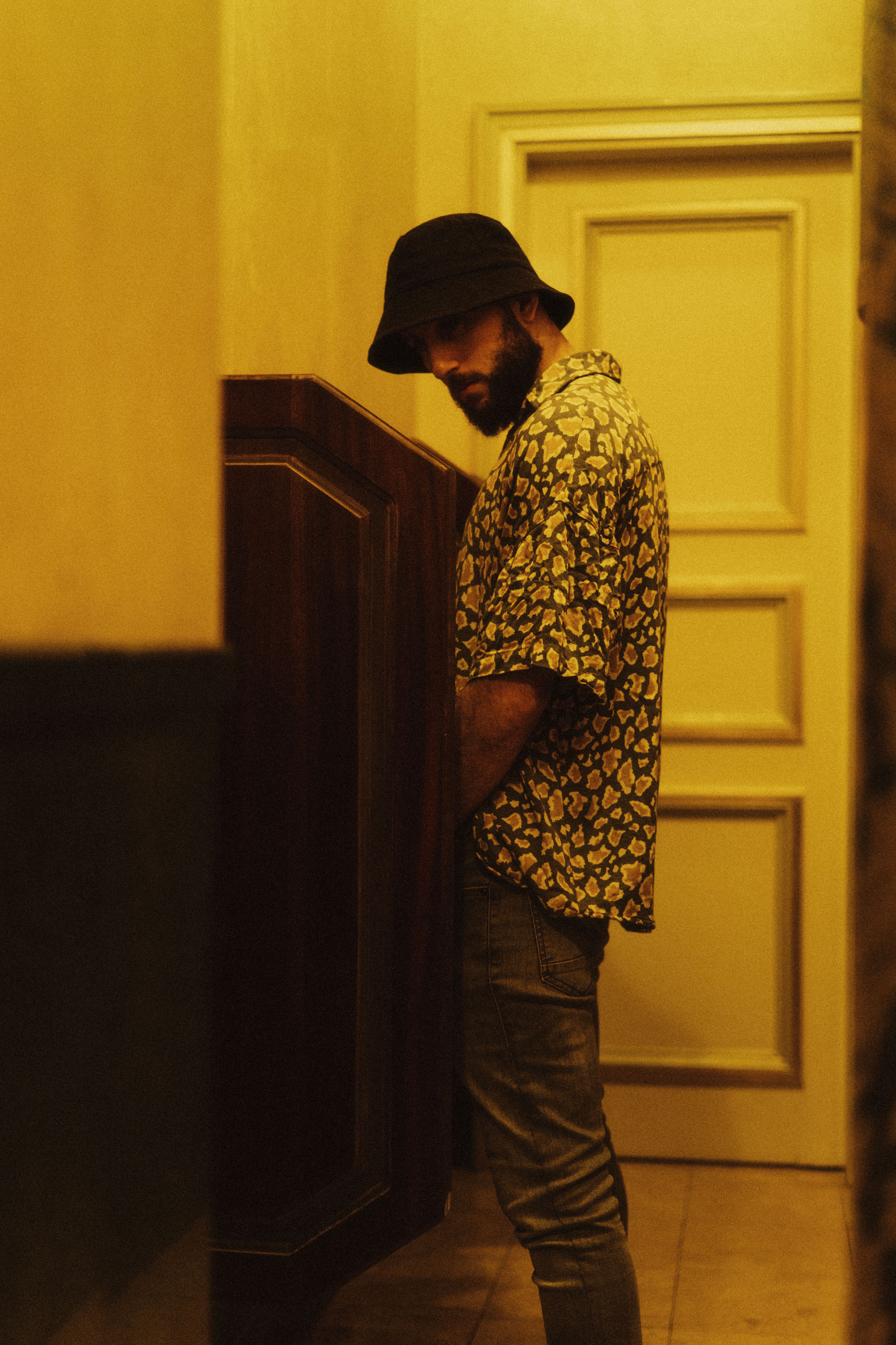 Man Standing at the Urinal in the Bathroom · Free Stock Photo