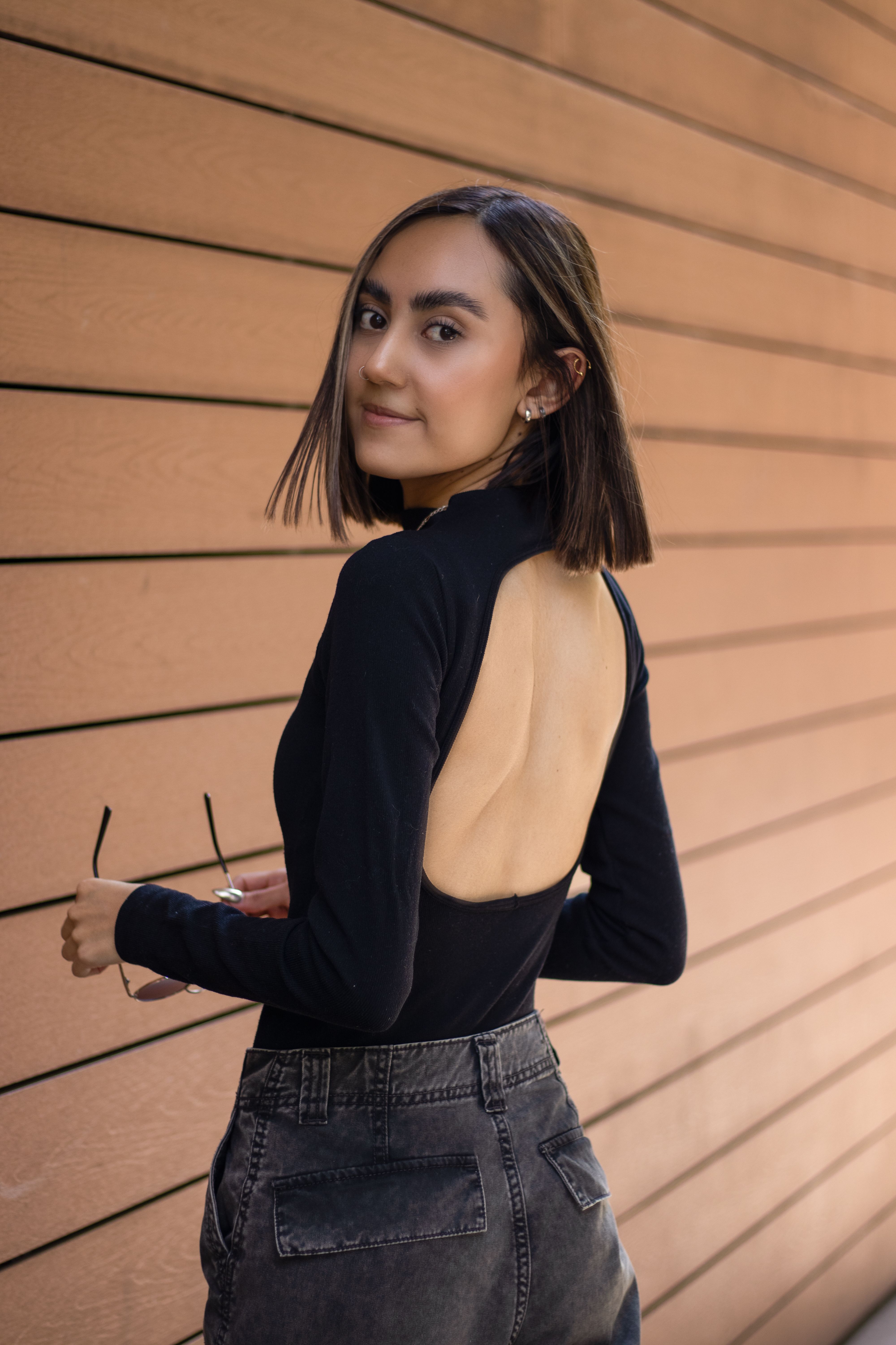 Beautiful Young Woman Looking Over Her Shoulder · Free Stock Photo
