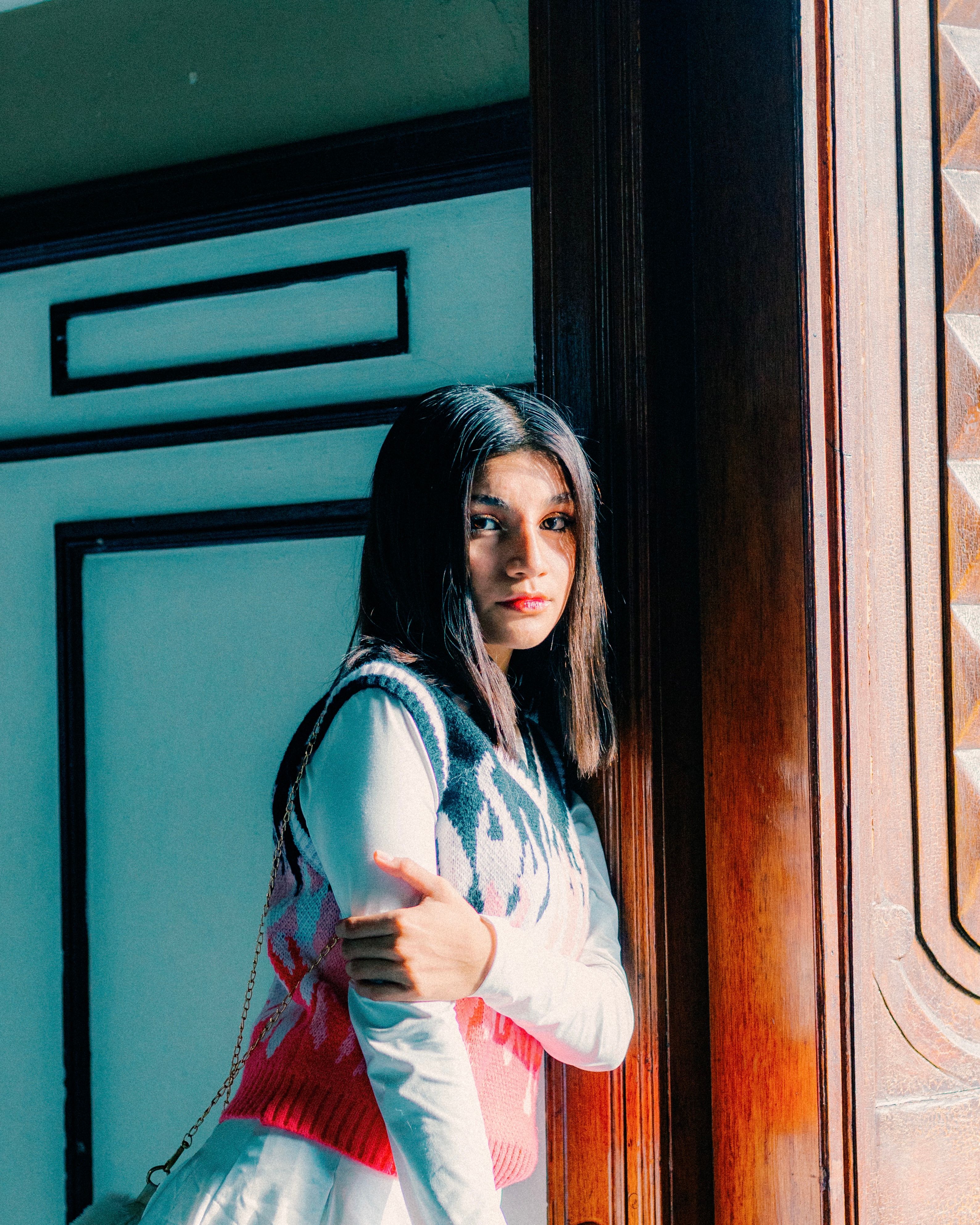Model Standing and Posing by Wall · Free Stock Photo