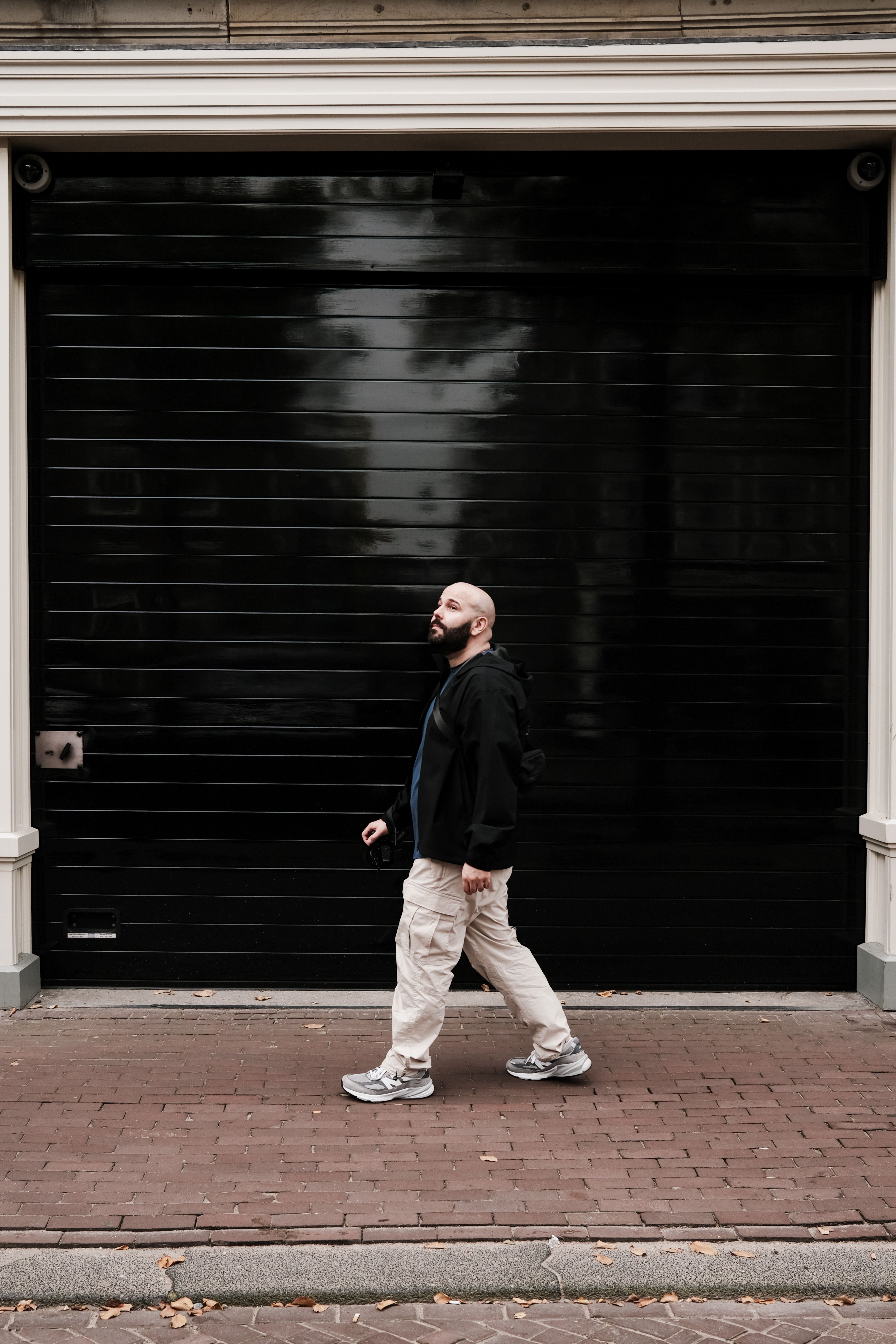 Bald Man Walking on Sidewalk · Free Stock Photo