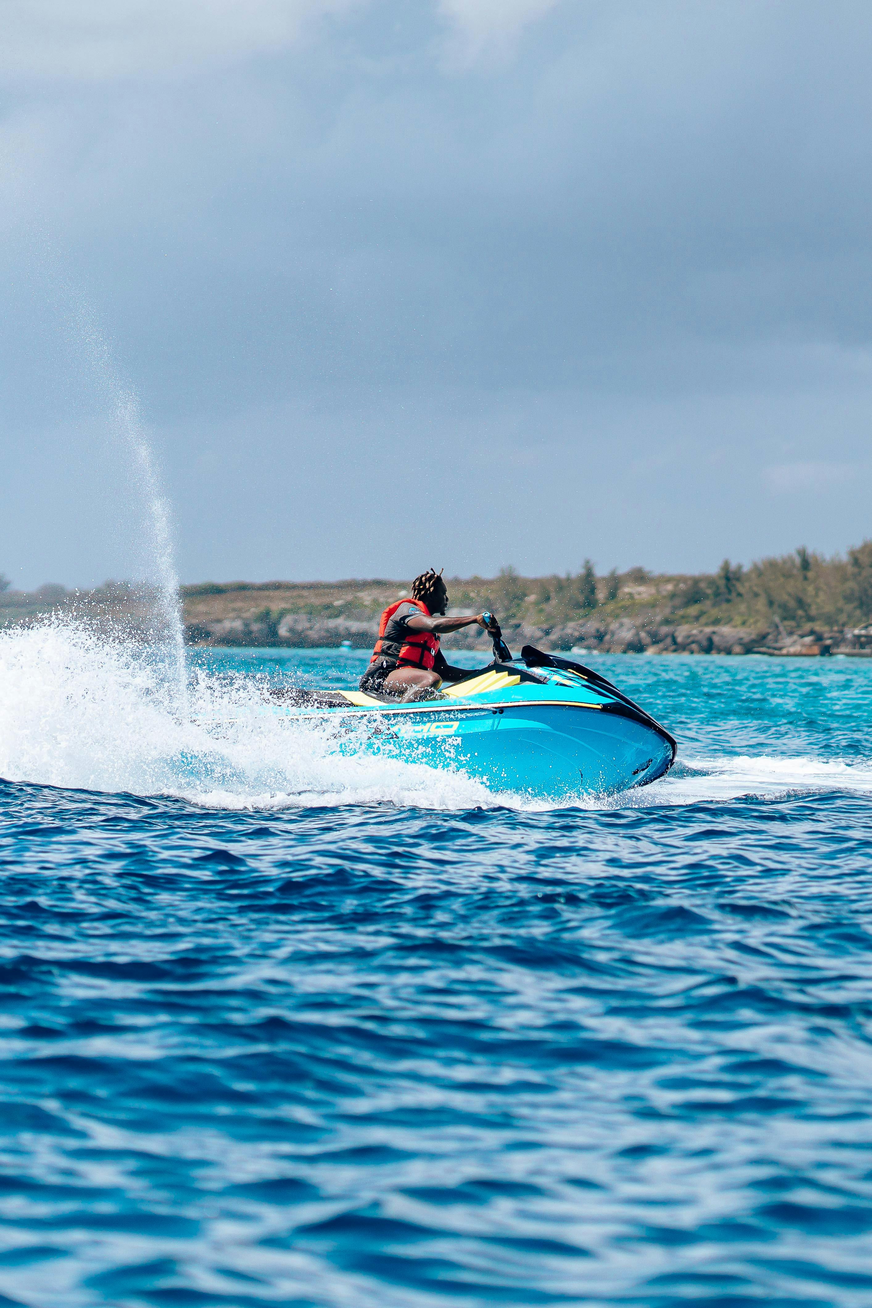 Man on Blue Jet Ski on Ocean · Free Stock Photo