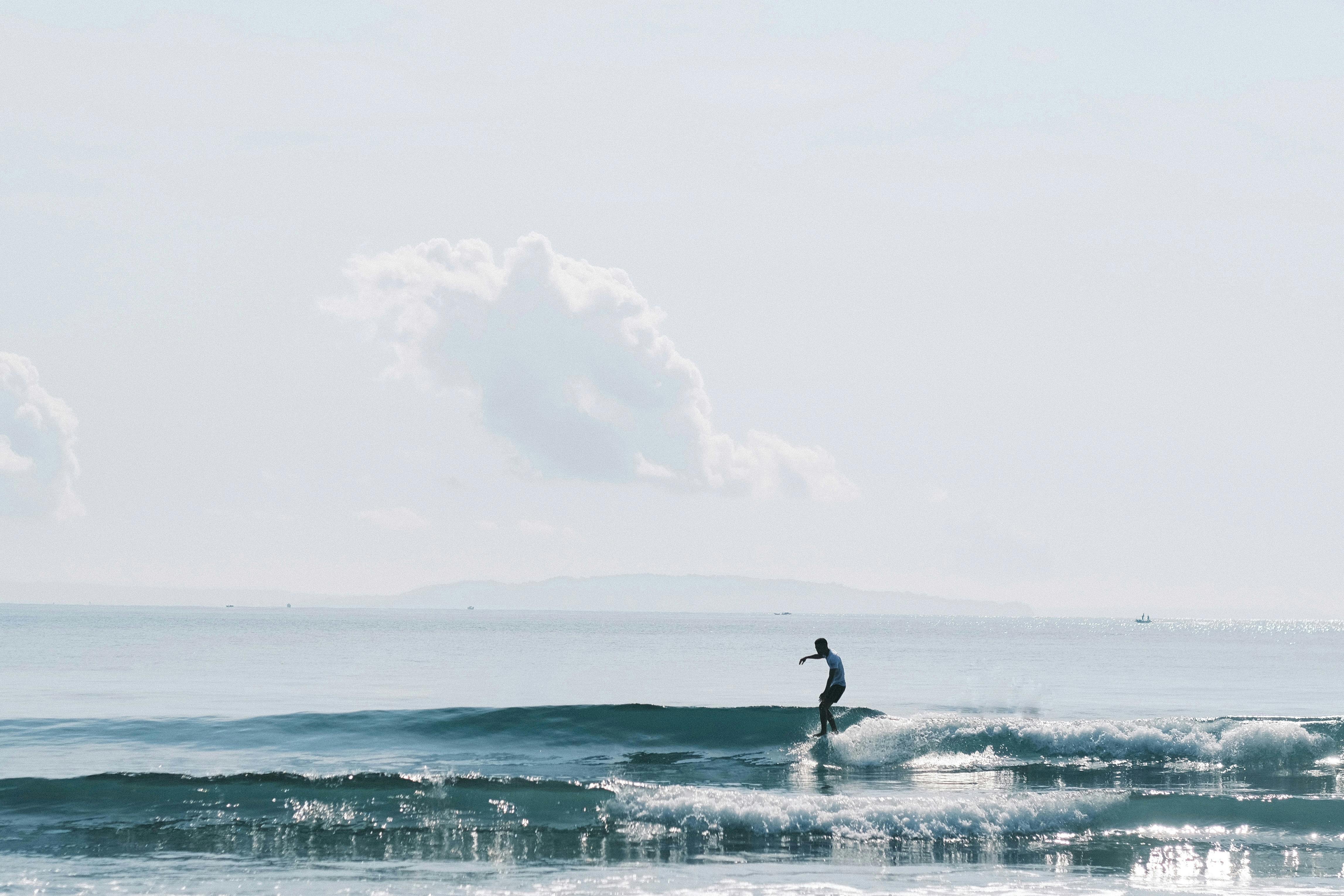 Surfer on Waves on Sea Shore · Free Stock Photo