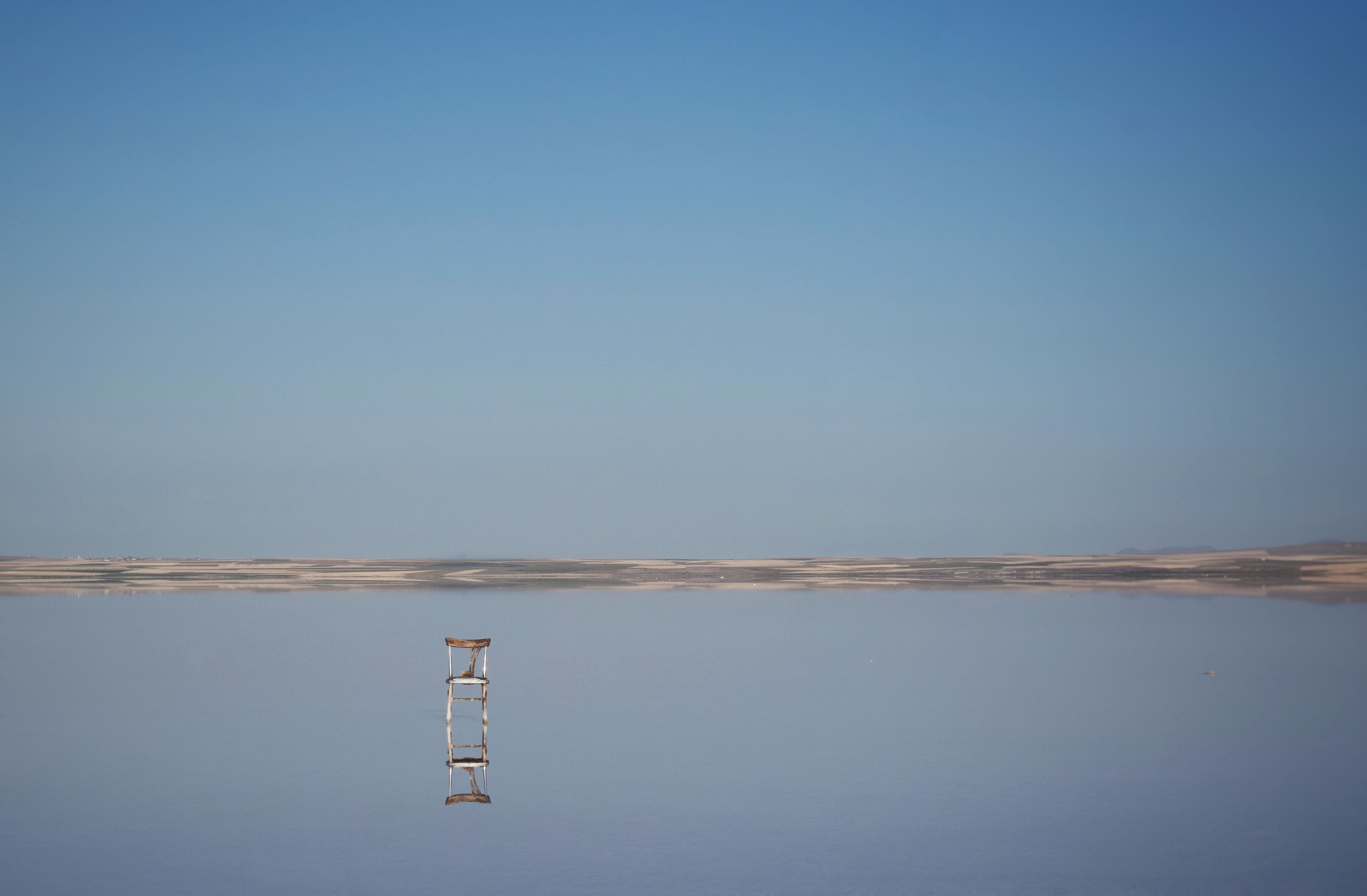 Chair on Shallow Water on Plains · Free Stock Photo