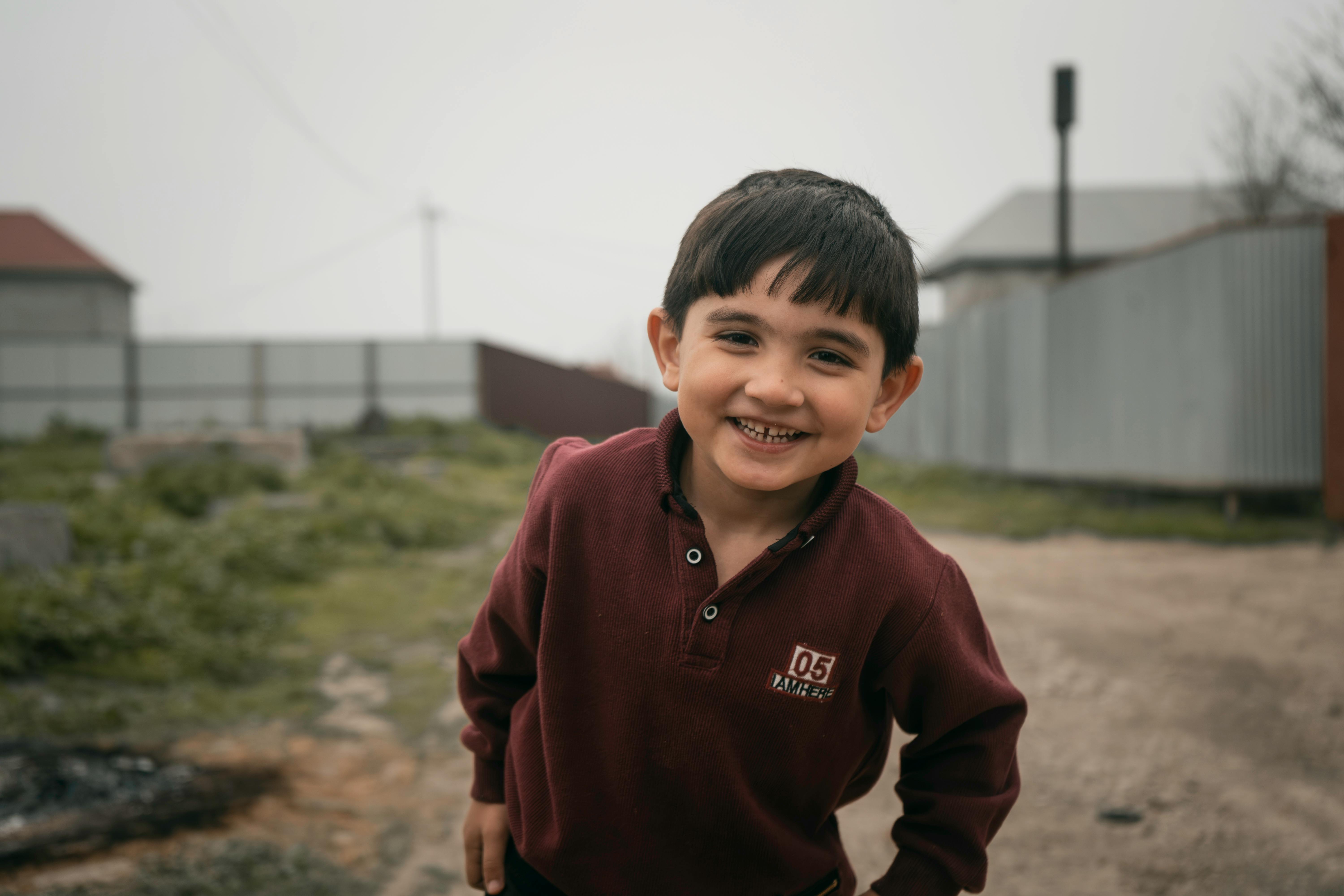 Young Arab Boy Holding Flags of Oman · Free Stock Photo