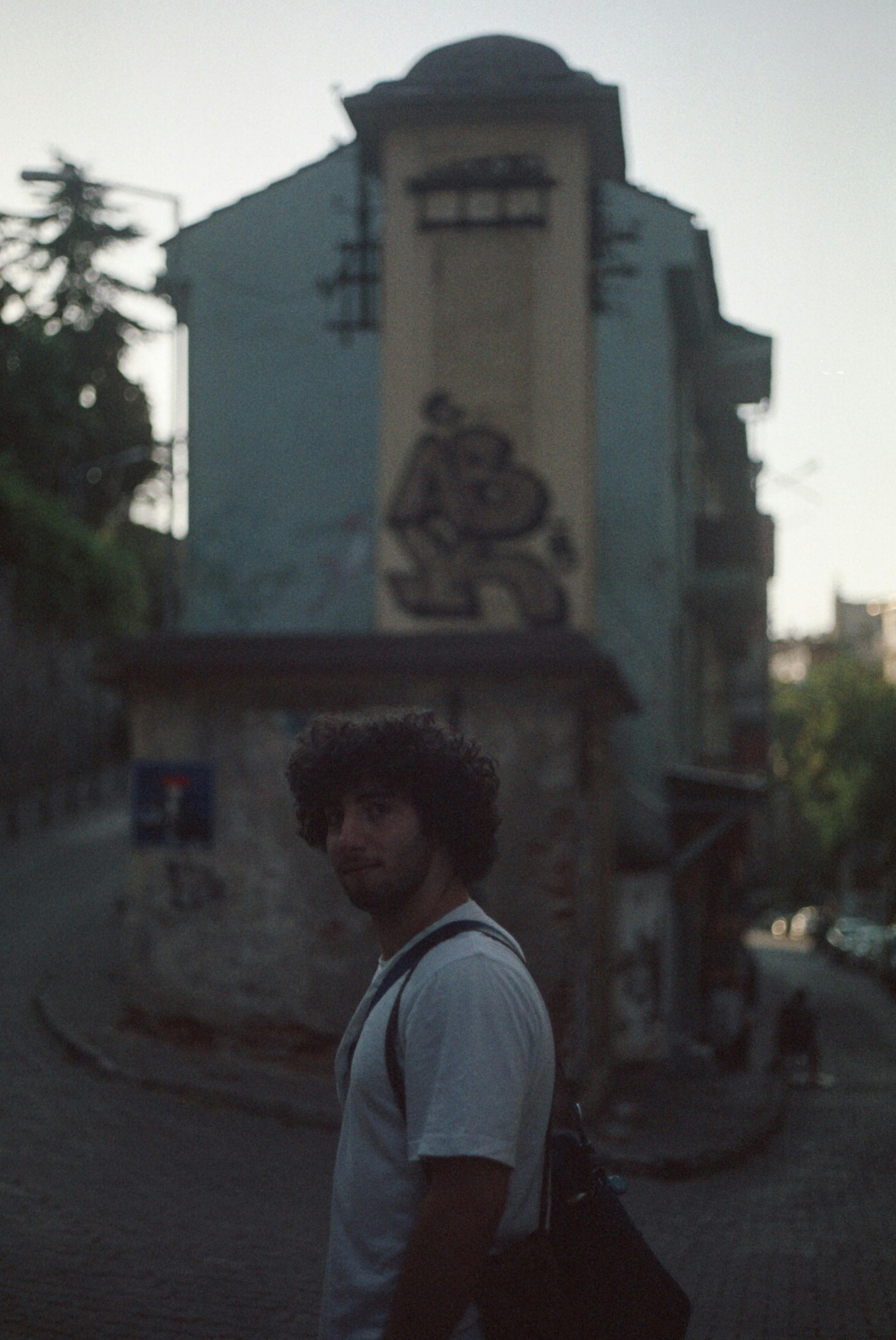 Tourist at the Bend of a Steep Alley · Free Stock Photo