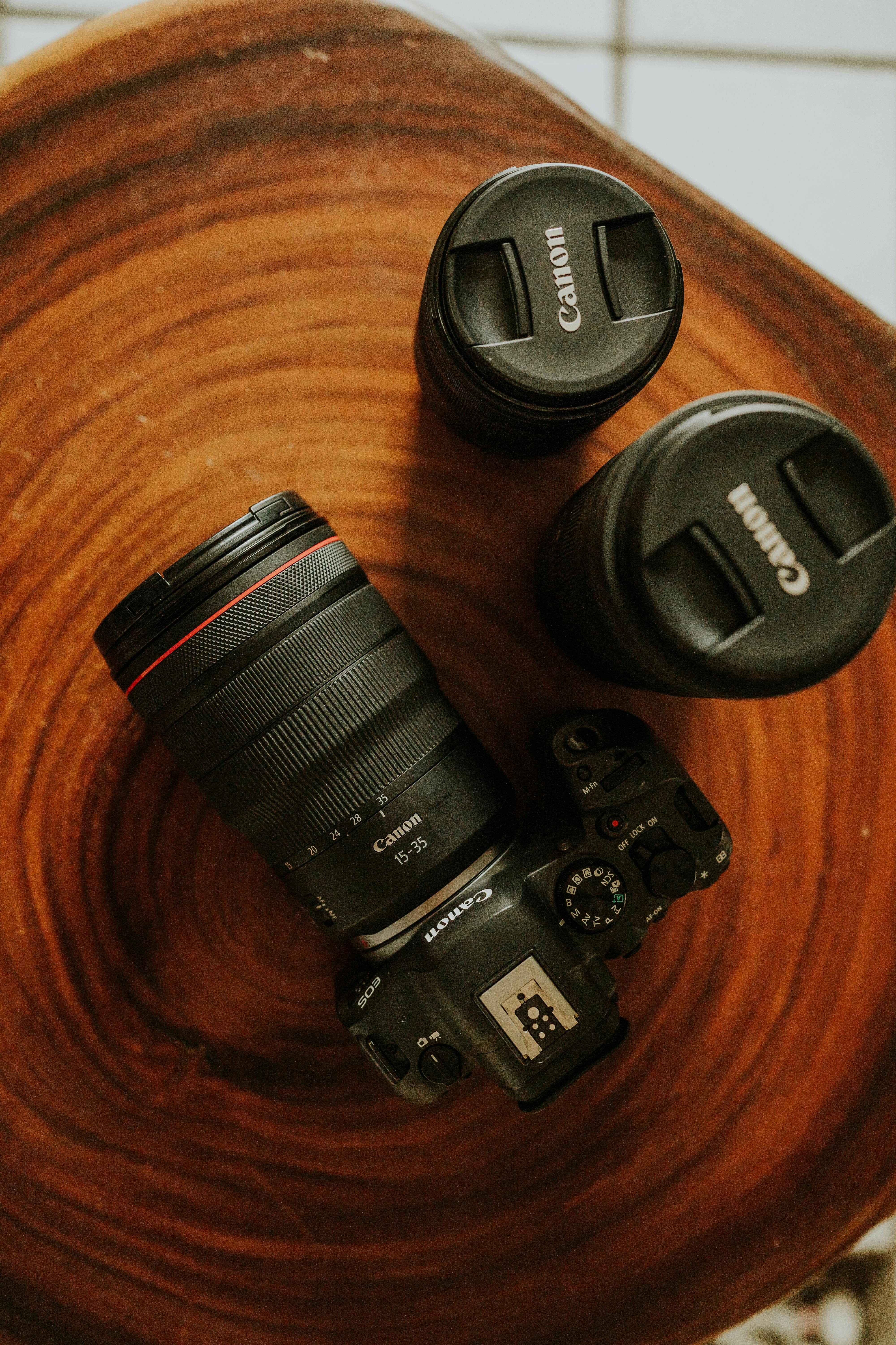 Top View of a Canon SLR Camera and Lenses Standing on a Table · Free ...