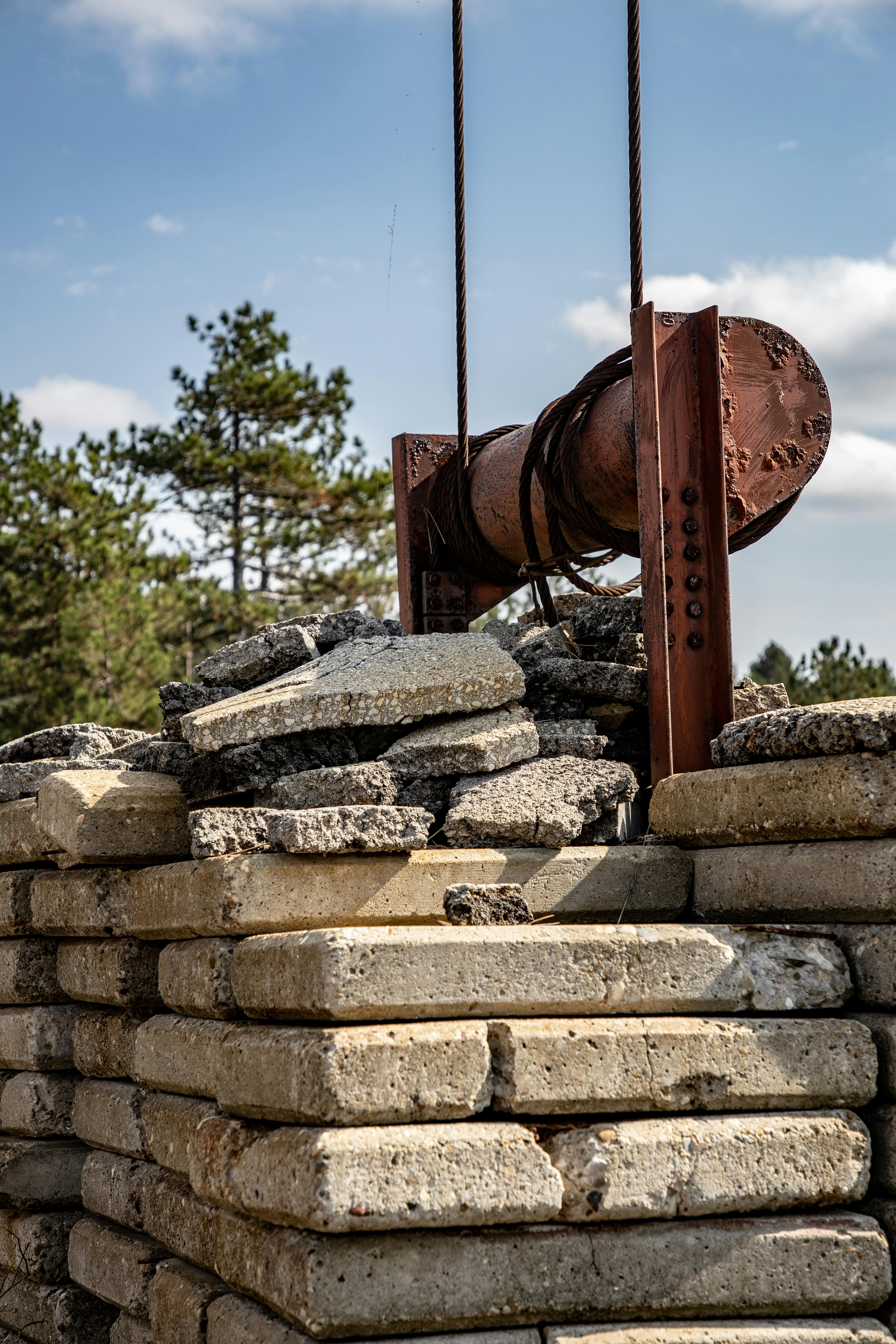 Stone Blocks Stacked by Wall · Free Stock Photo