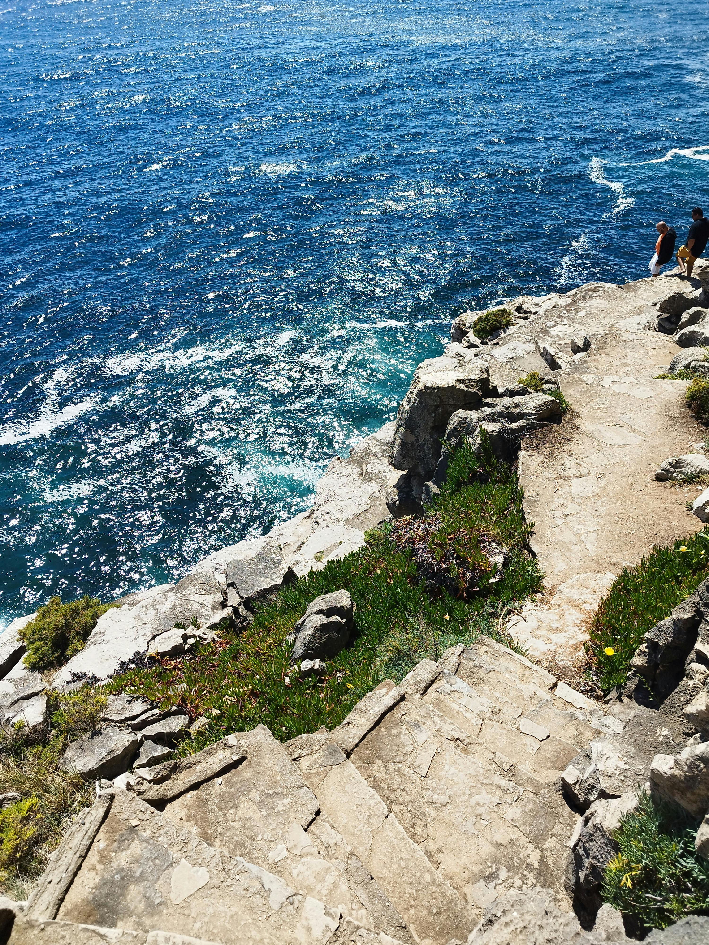 Steps Cut Into Cliff Beside the Ocean · Free Stock Photo