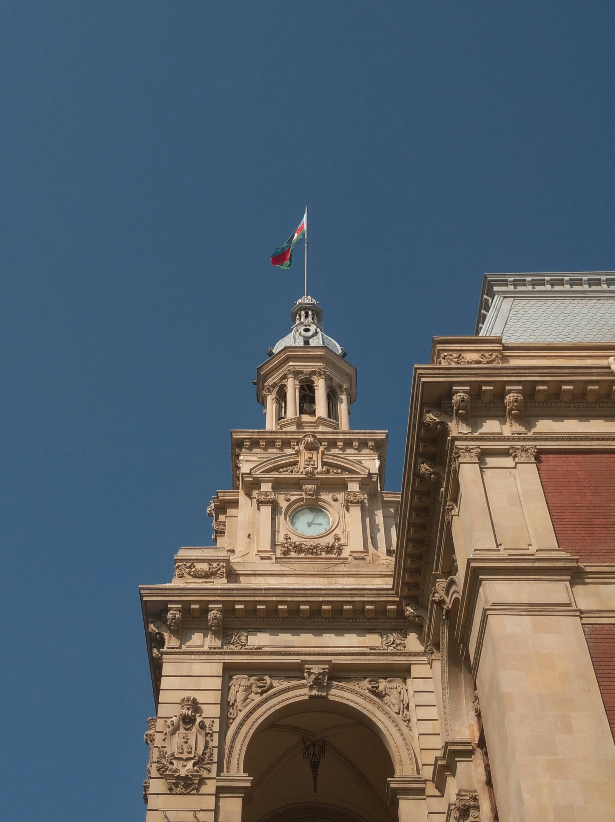 Brown High Rise Building Surrounded by People · Free Stock Photo