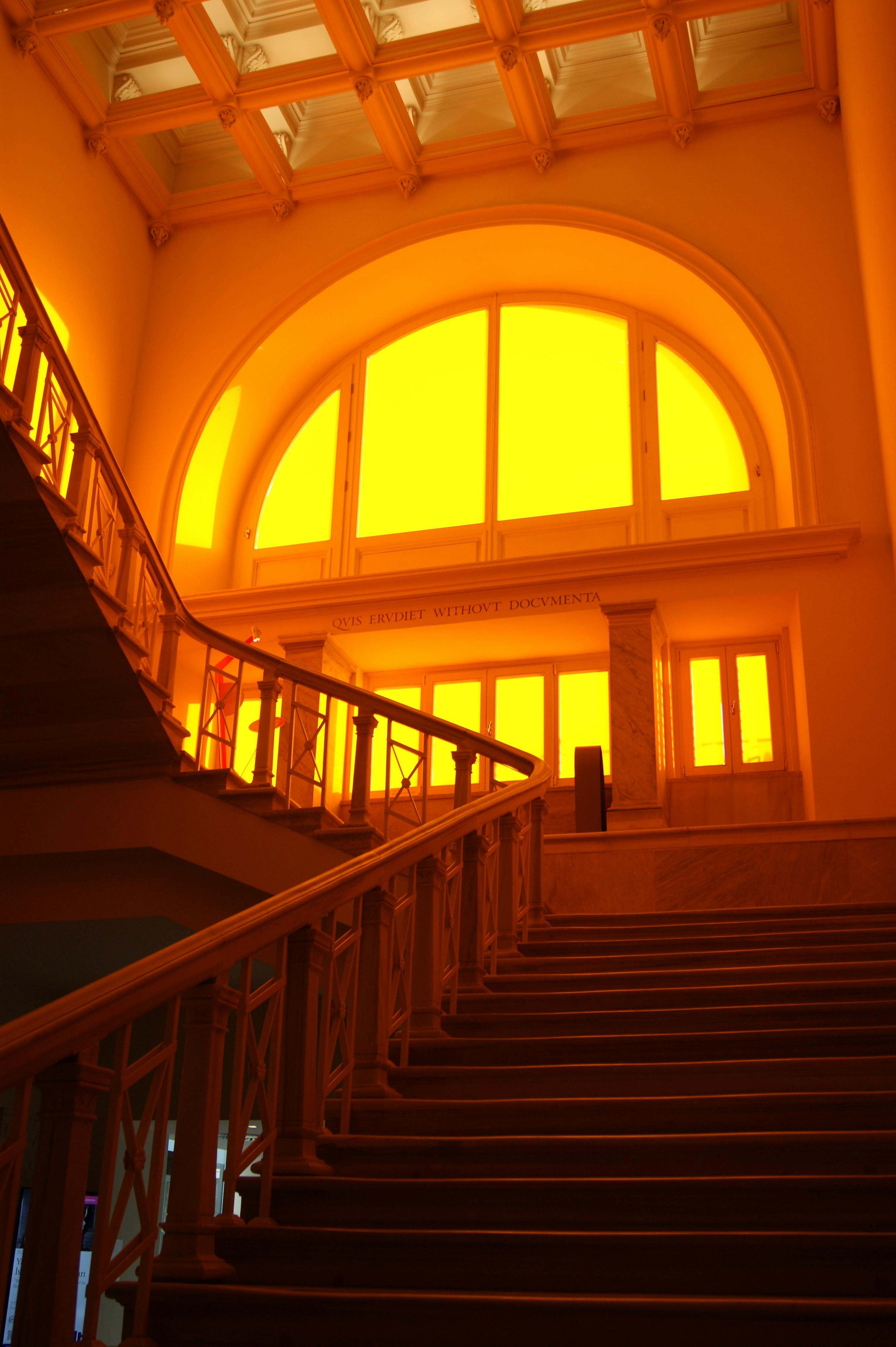 Yellow Light in Windows behind Stairs · Free Stock Photo