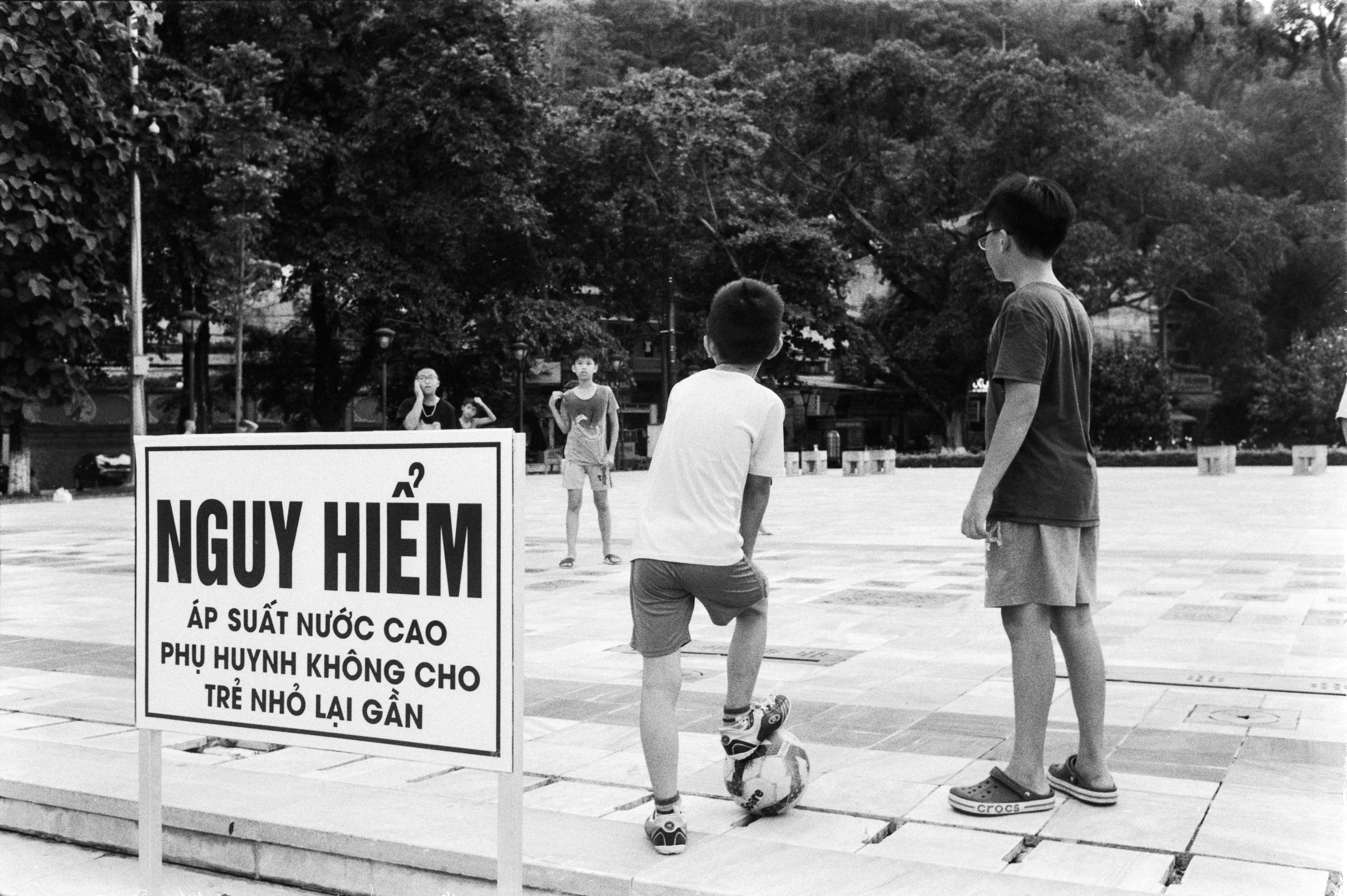 Little Boys on a Pavement in Black and White · Free Stock Photo