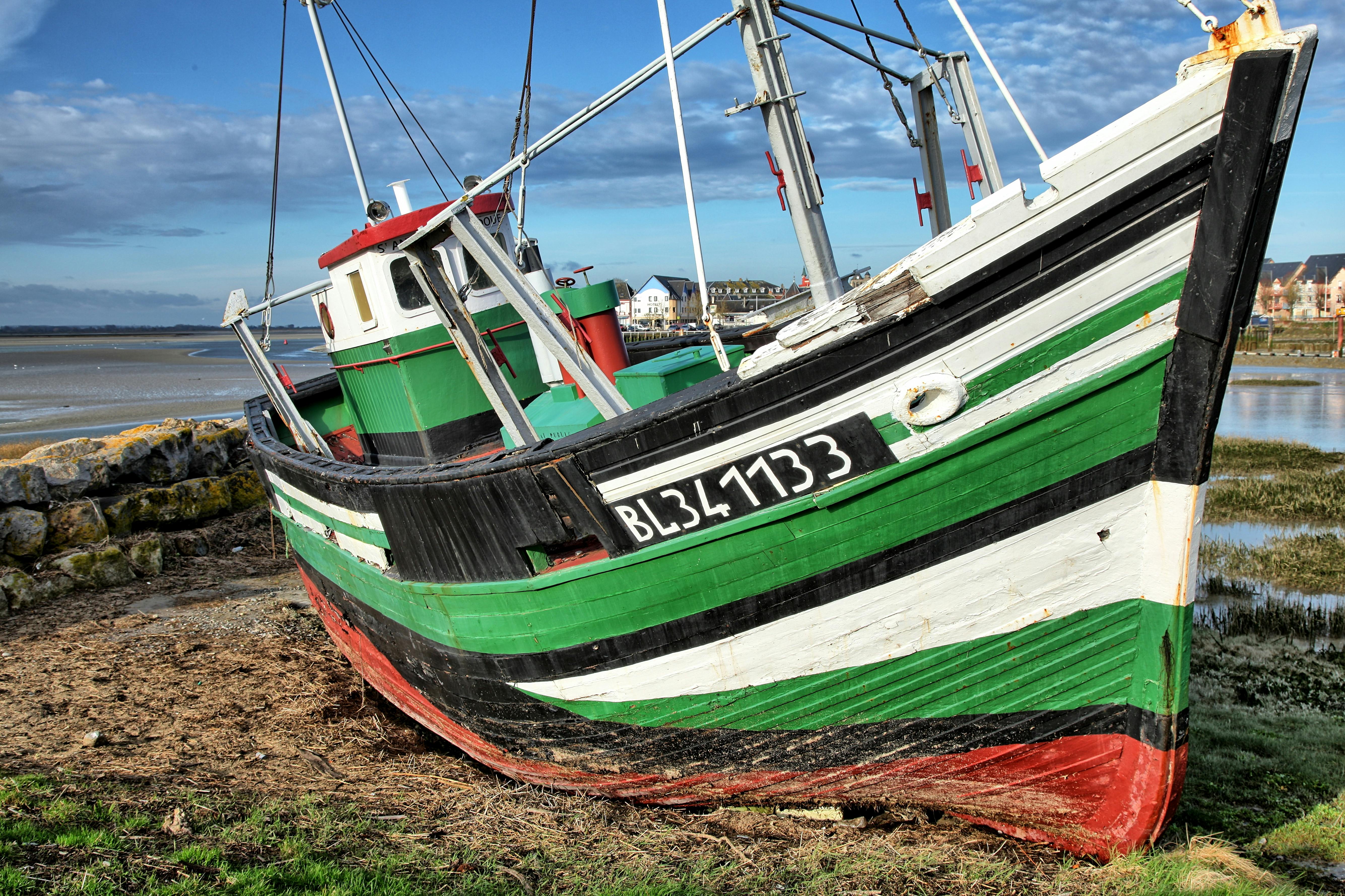 Green Fishing Boat on Shore · Free Stock Photo