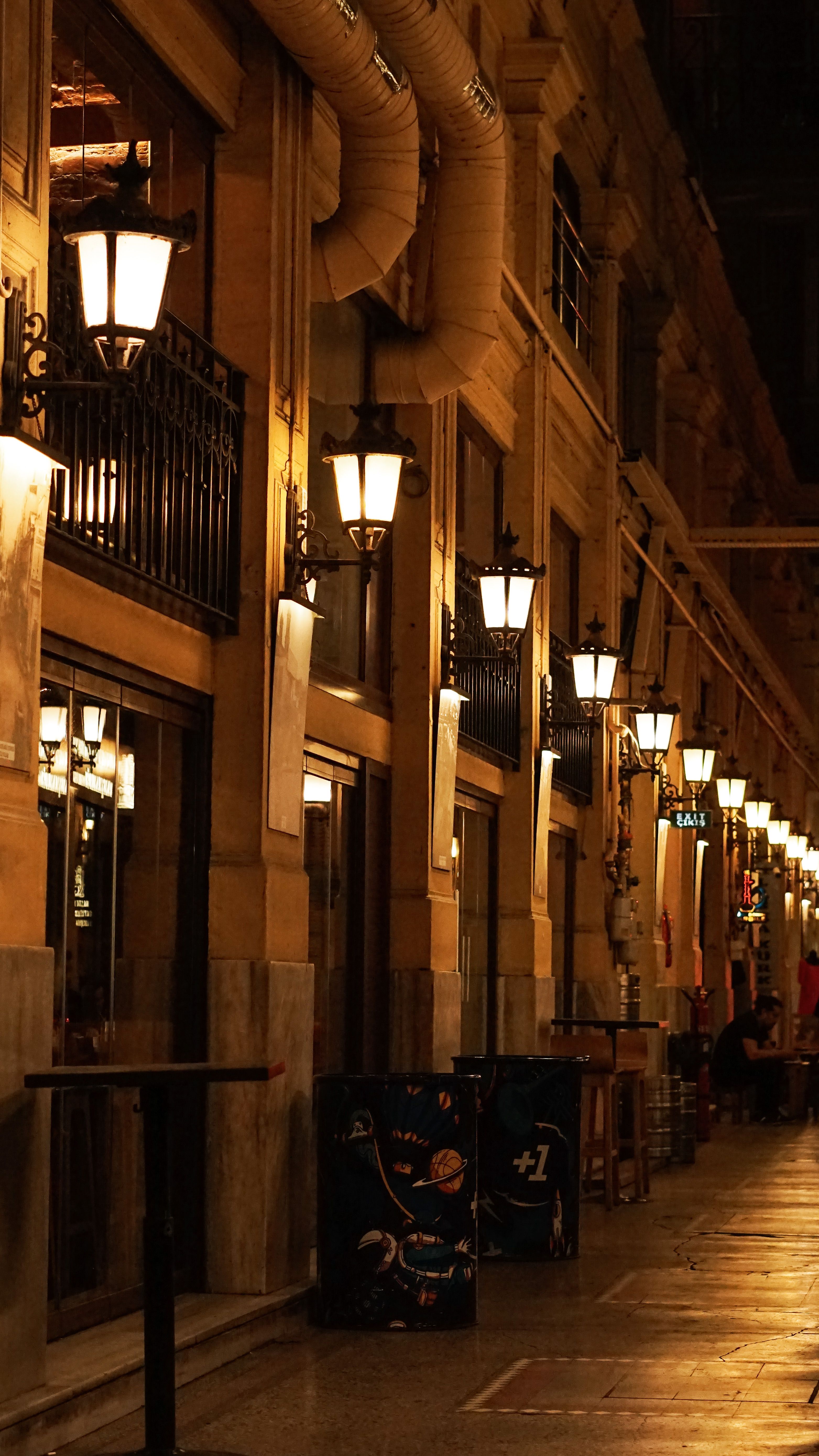 Photo of an Alley with Street Lamps · Free Stock Photo