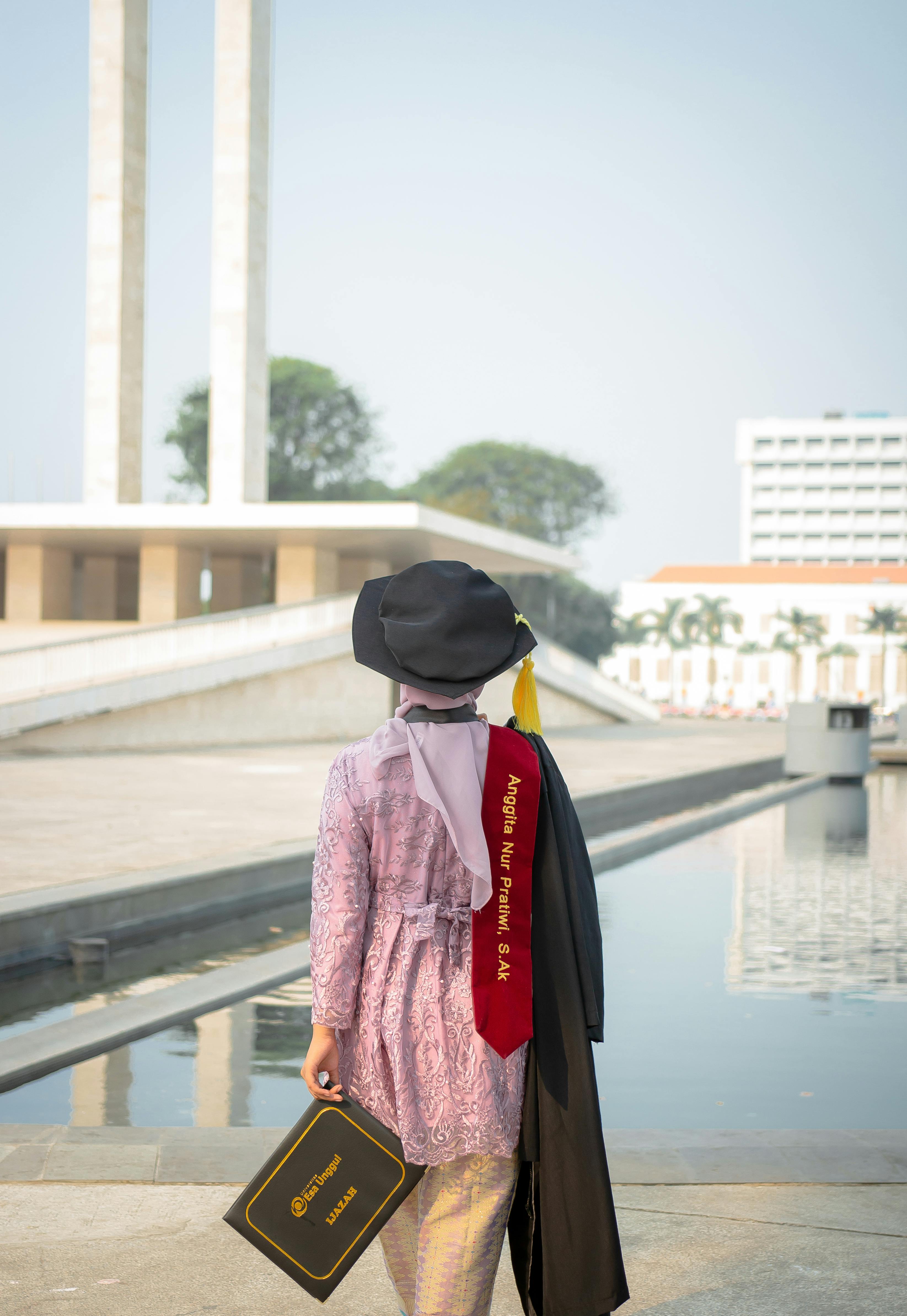 Gray Haired Woman Smiling Beside the Newly Graduate Student · Free ...