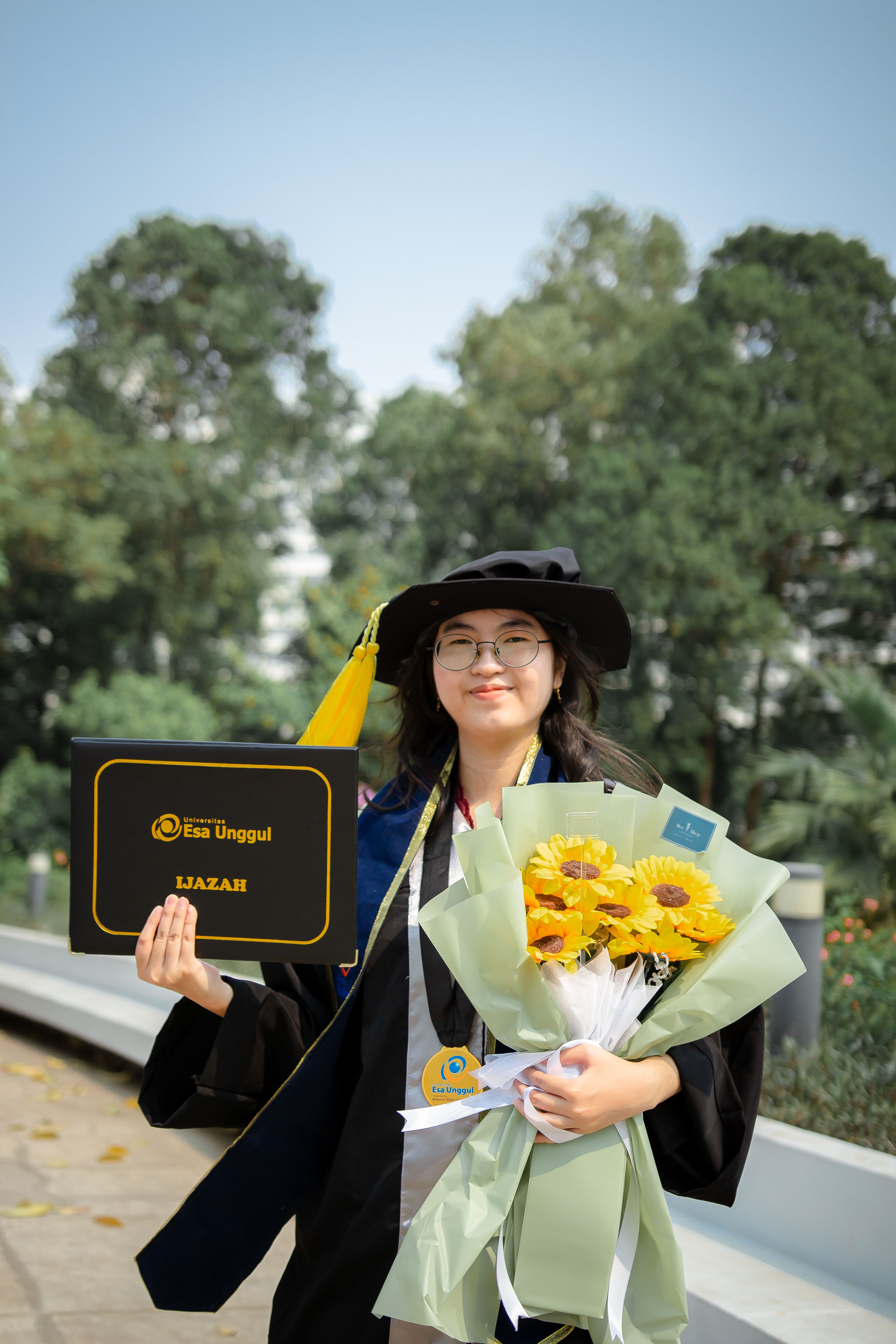 Young Woman in Black Graduation Gown Wearing Beige Hijab · Free Stock Photo