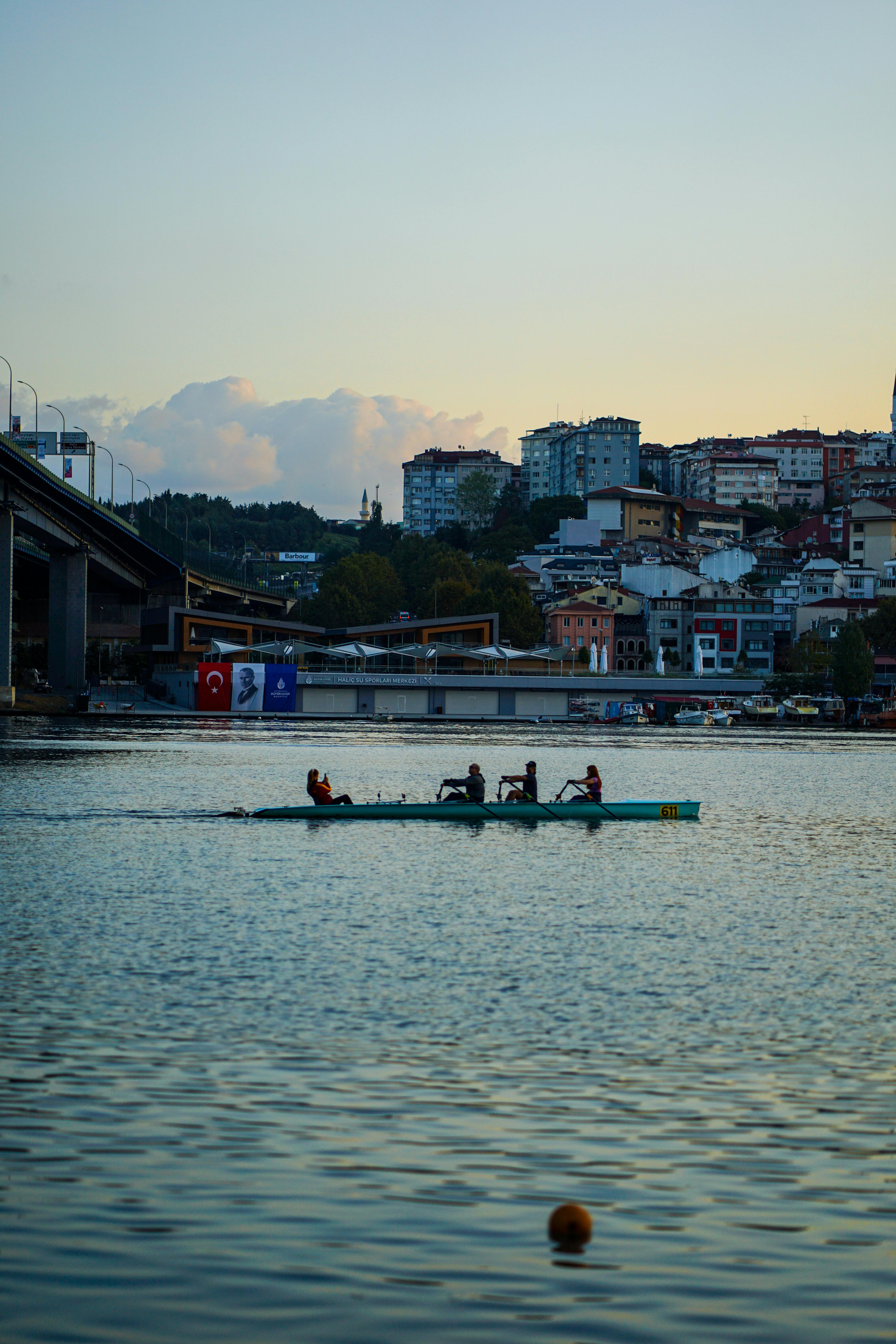 People Rowing on River in Town in Turkey · Free Stock Photo