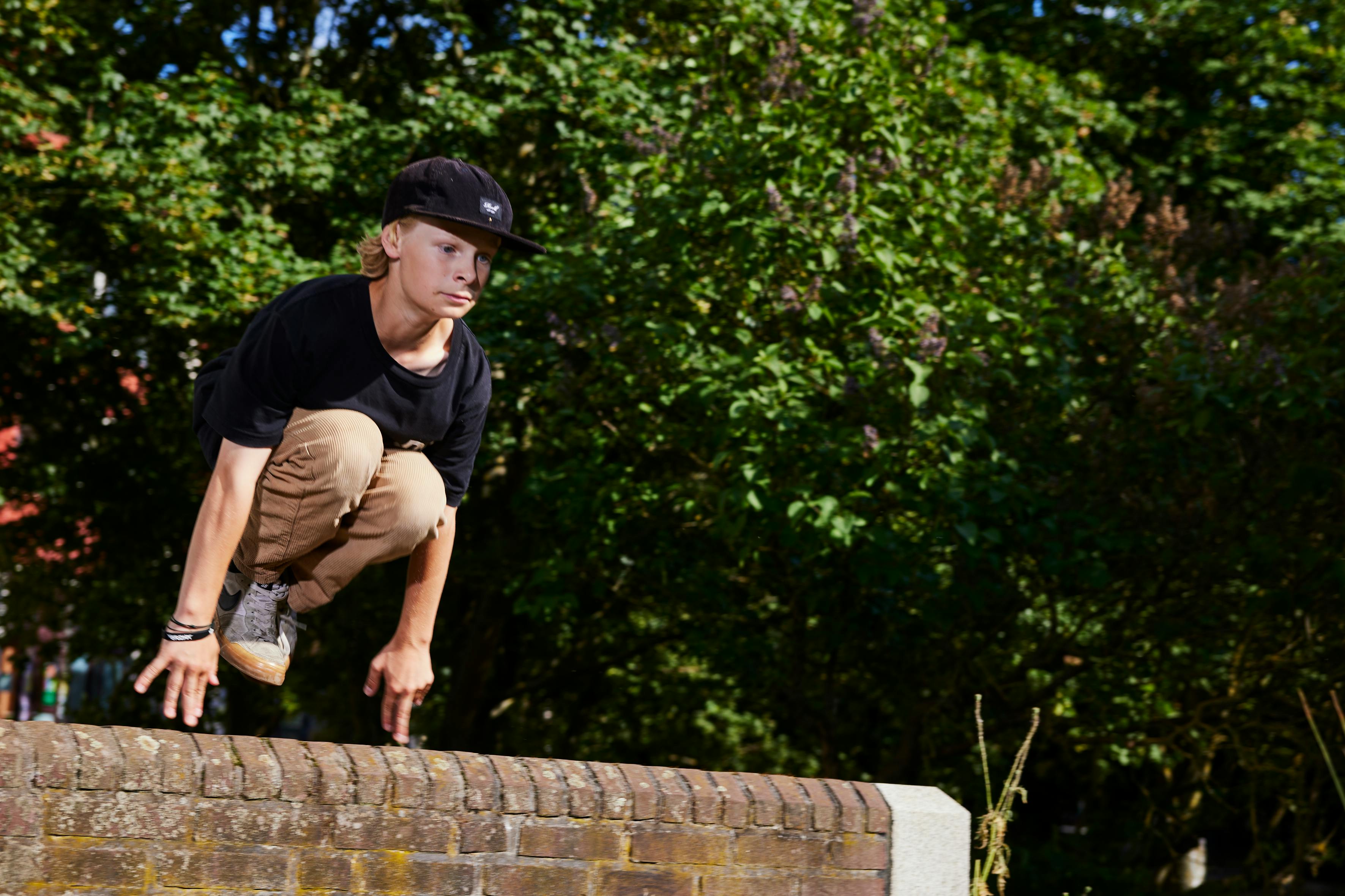 Boy Jumping over the Obstacle in a Park · Free Stock Photo