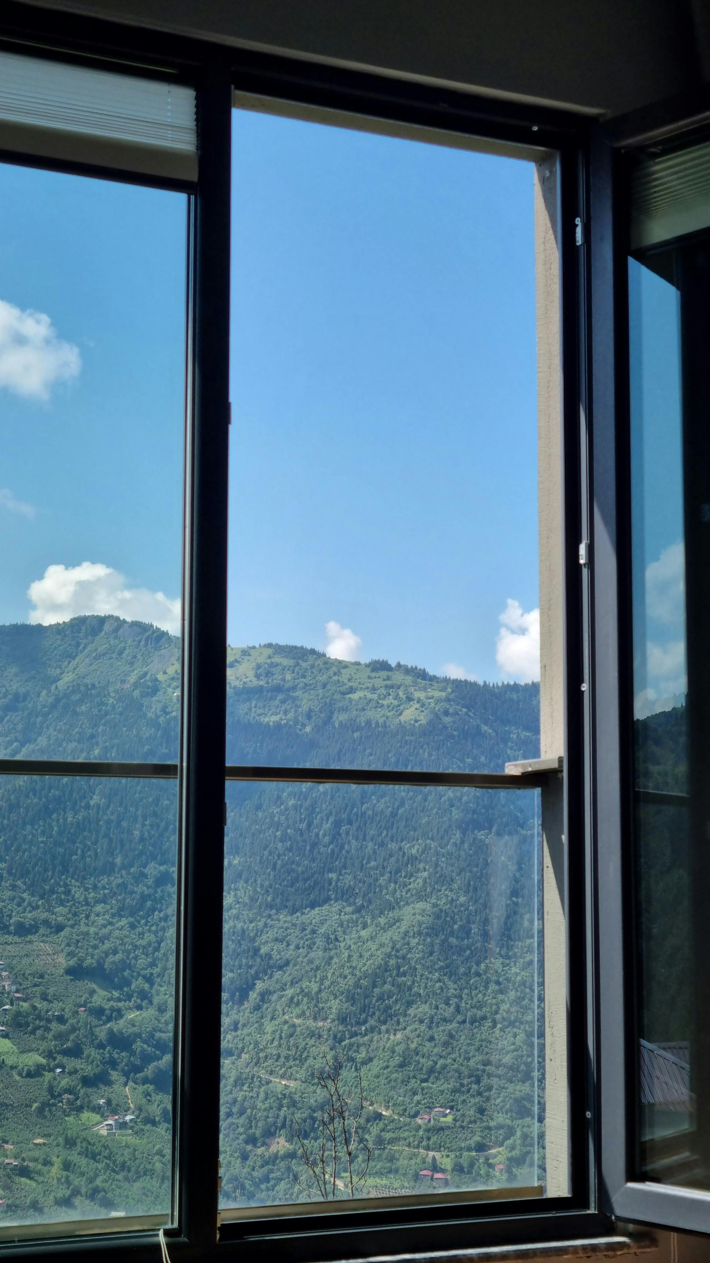 Window with a View of a Mountain · Free Stock Photo