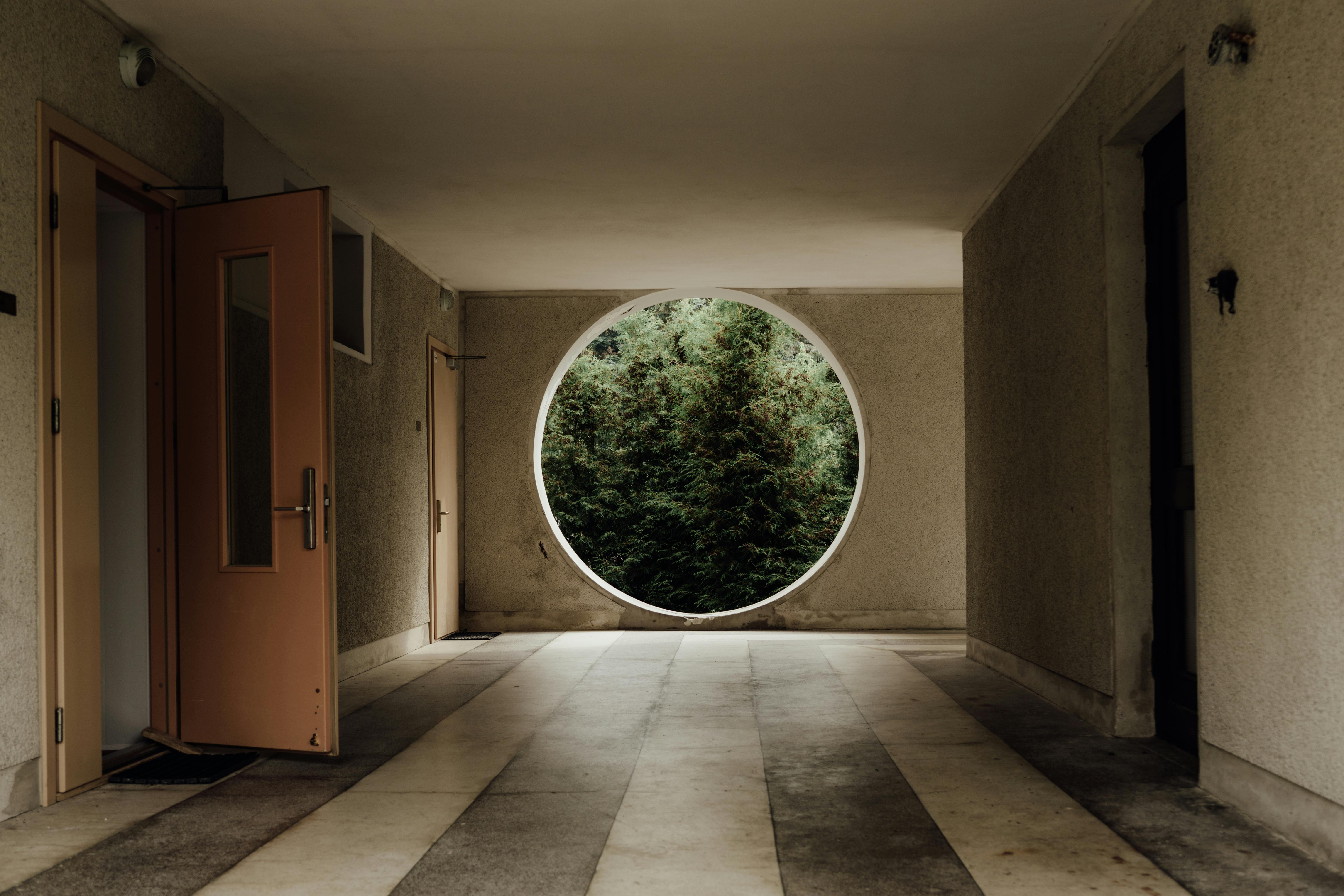 Round Window of the Apartment Building Entrance · Free Stock Photo
