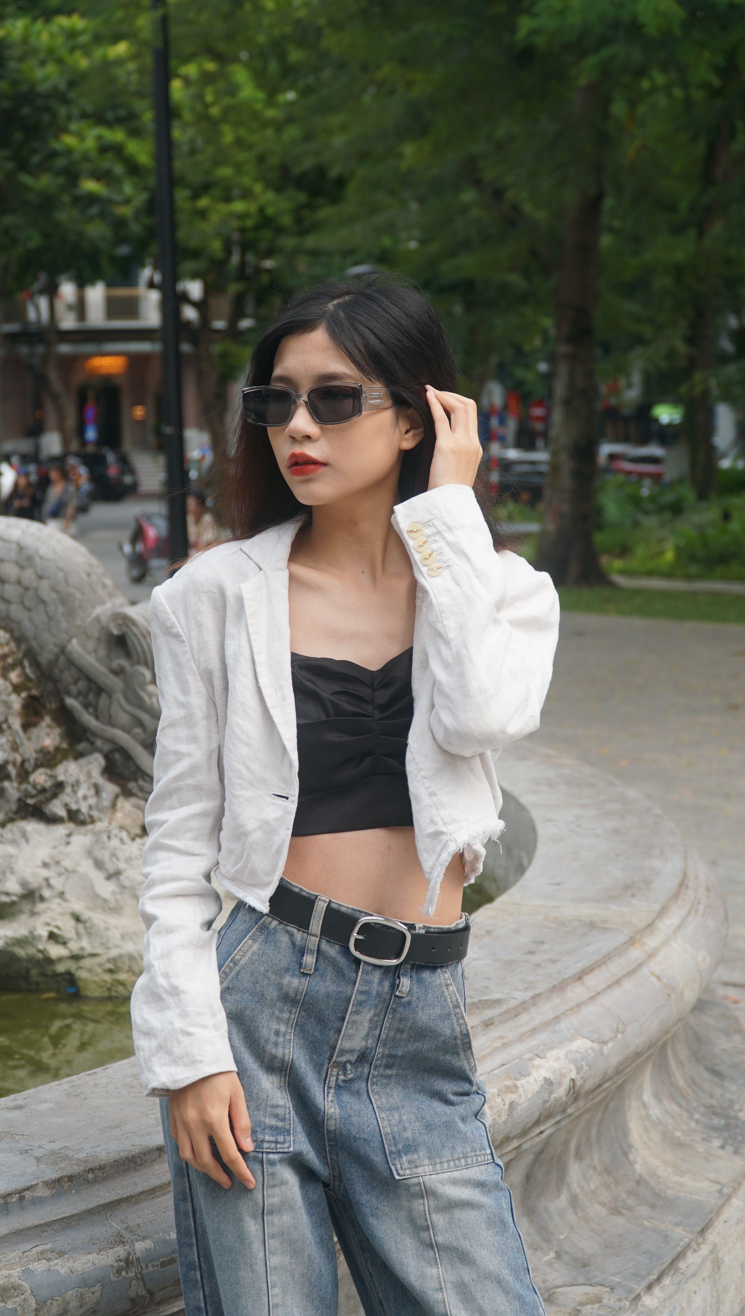 Model Sitting in Skinny Jeans · Free Stock Photo
