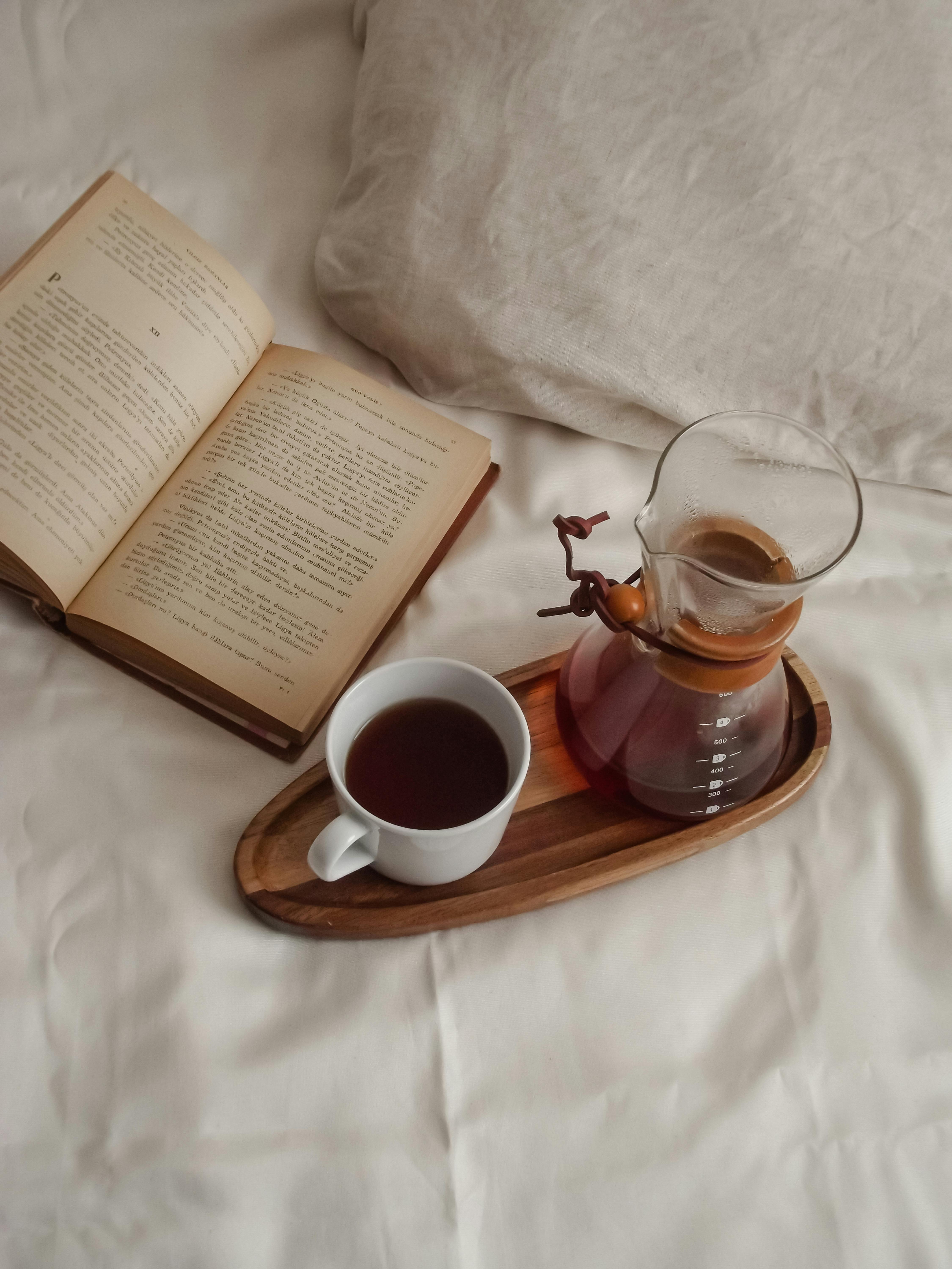 Coffee and book on comfortable bed · Free Stock Photo