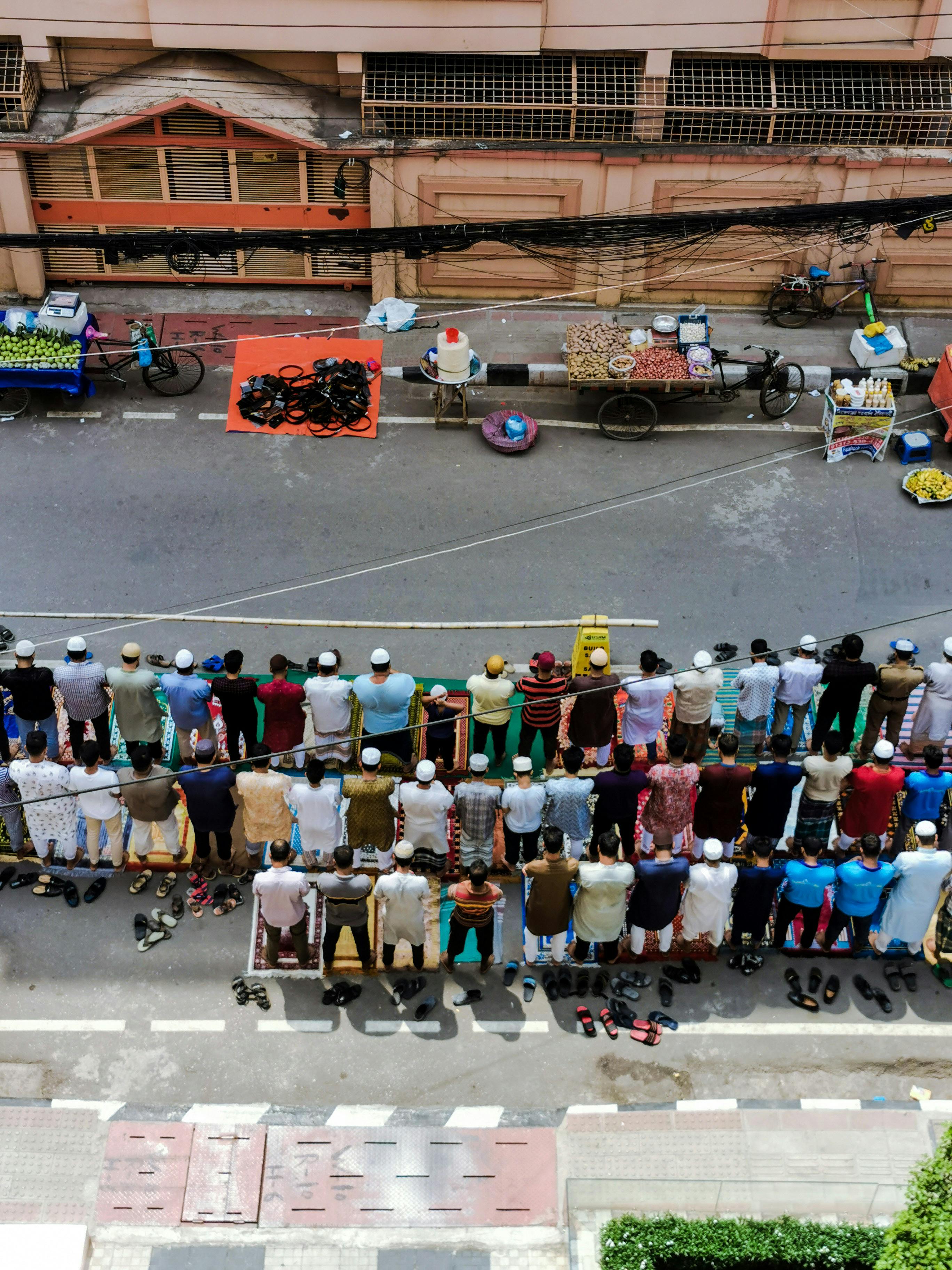 Aerial View of a Crowd Standing in Rows on the Street · Free Stock Photo