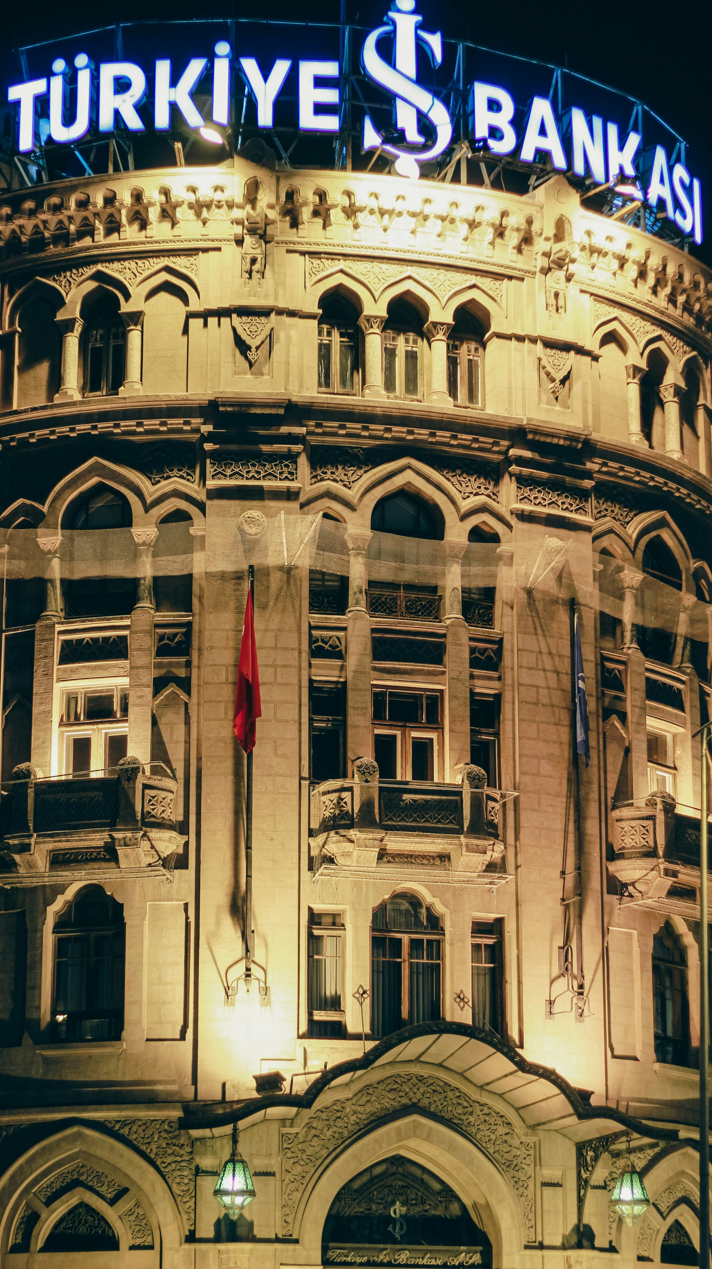 Facade of Bank Illuminated at Night · Free Stock Photo
