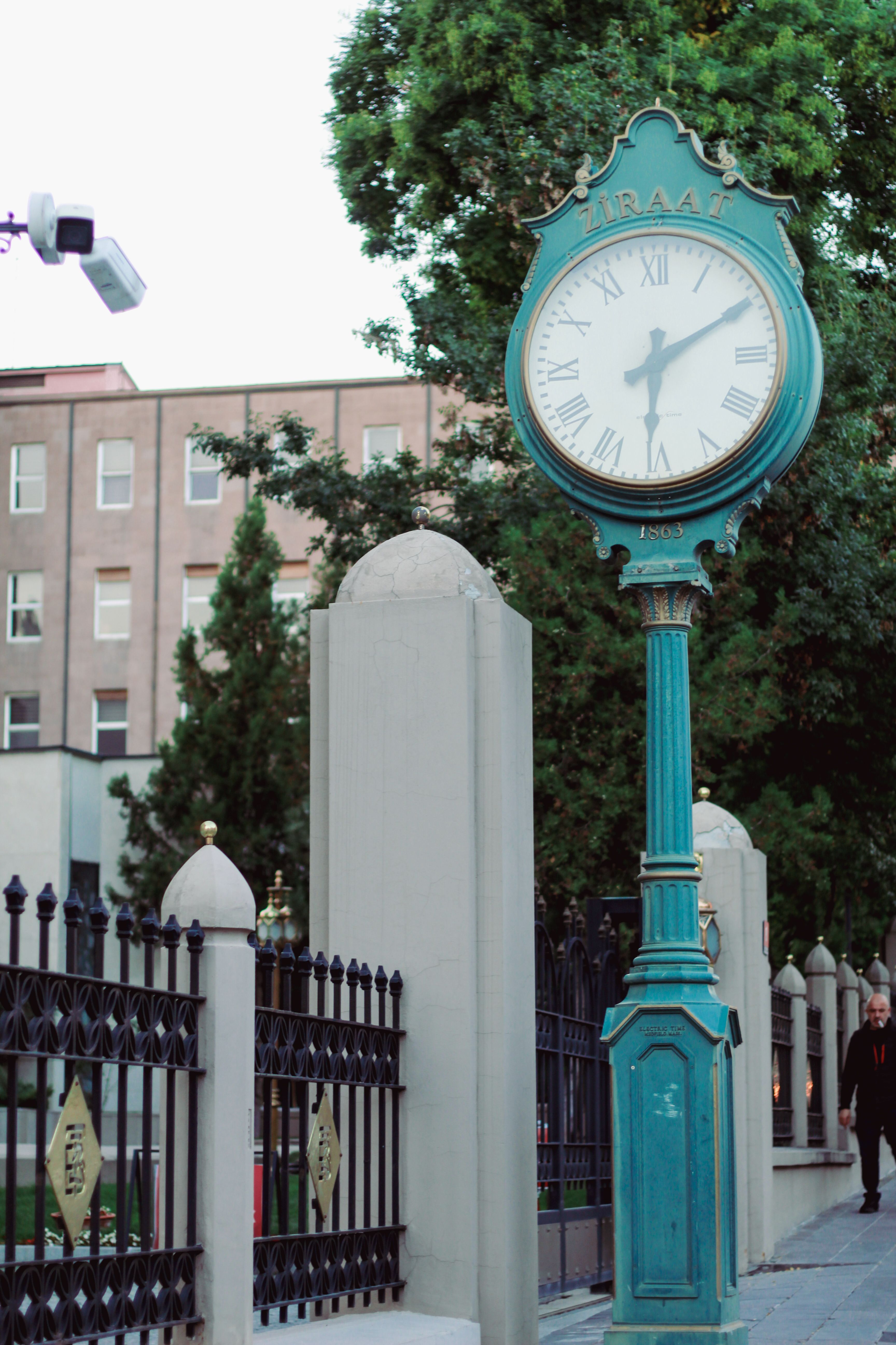 Retro Clock on Sidewalk · Free Stock Photo