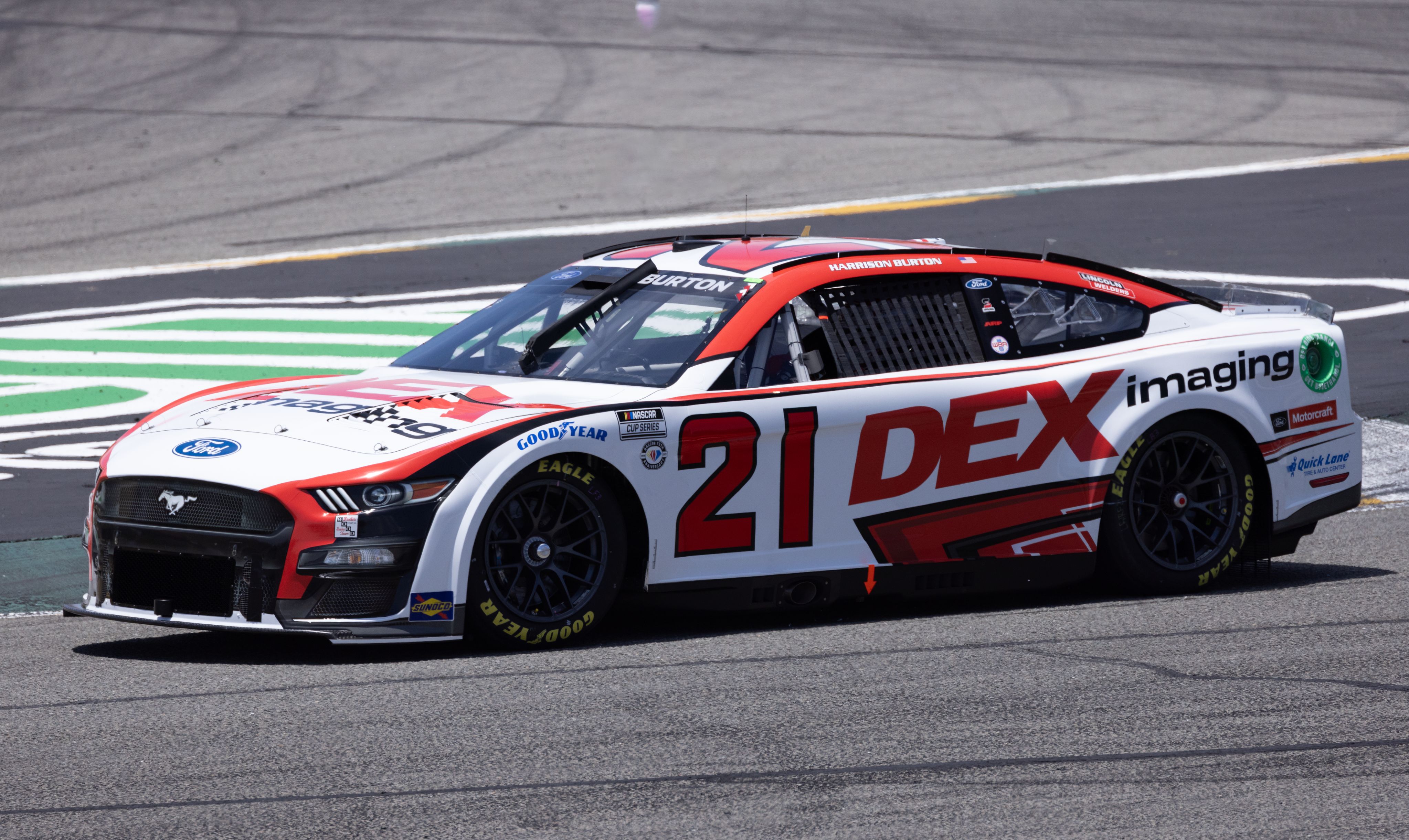 Photo of a Red and White Racing Car on a Track · Free Stock Photo