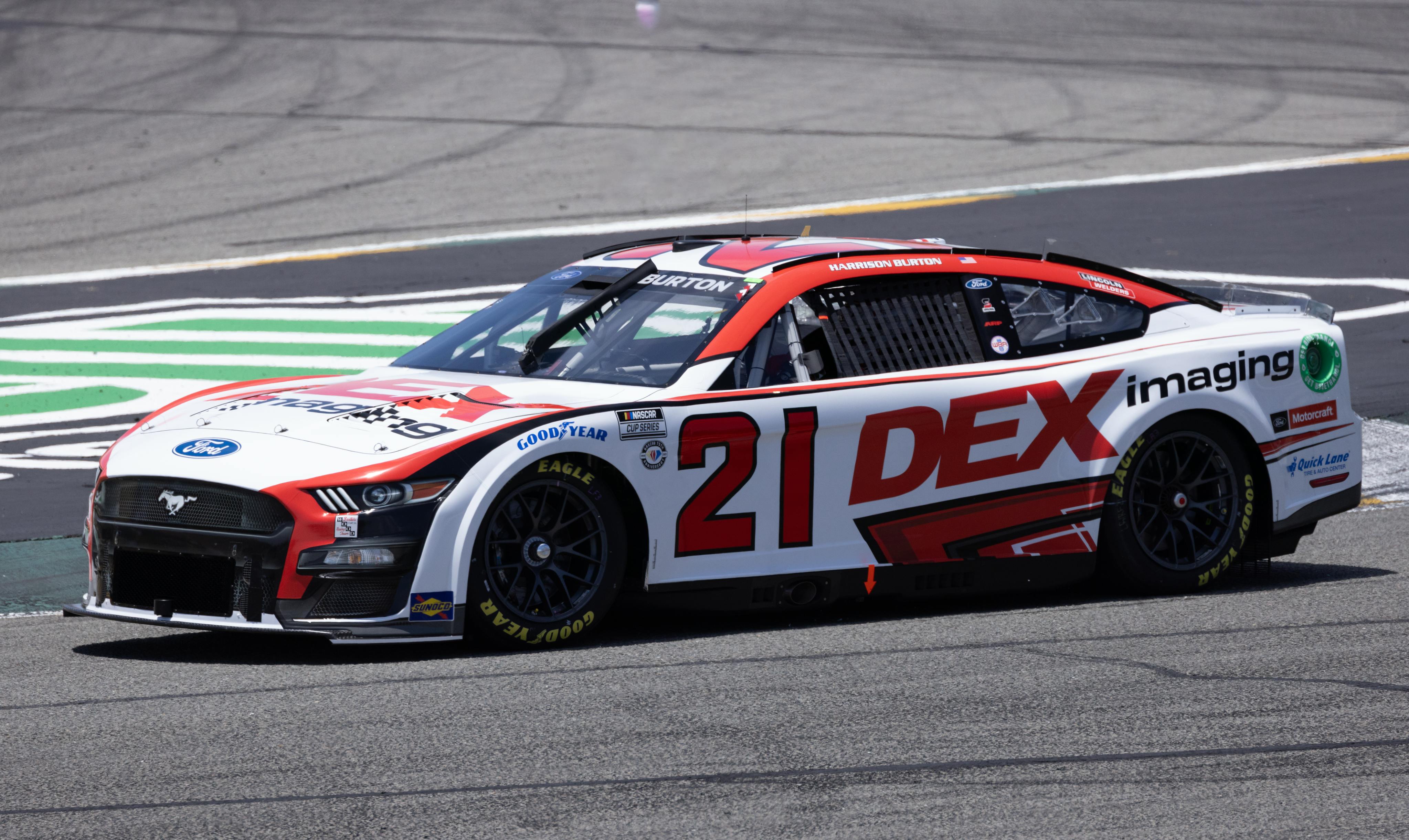 Photo of a Red and White Racing Car on a Track · Free Stock Photo