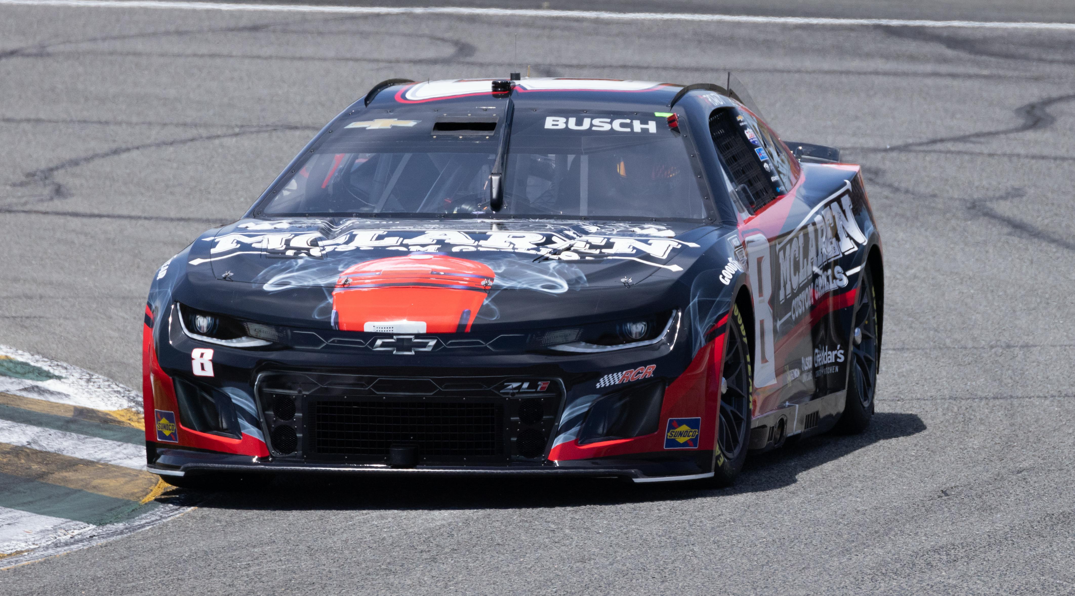 Red and Black Race Car on a Track · Free Stock Photo