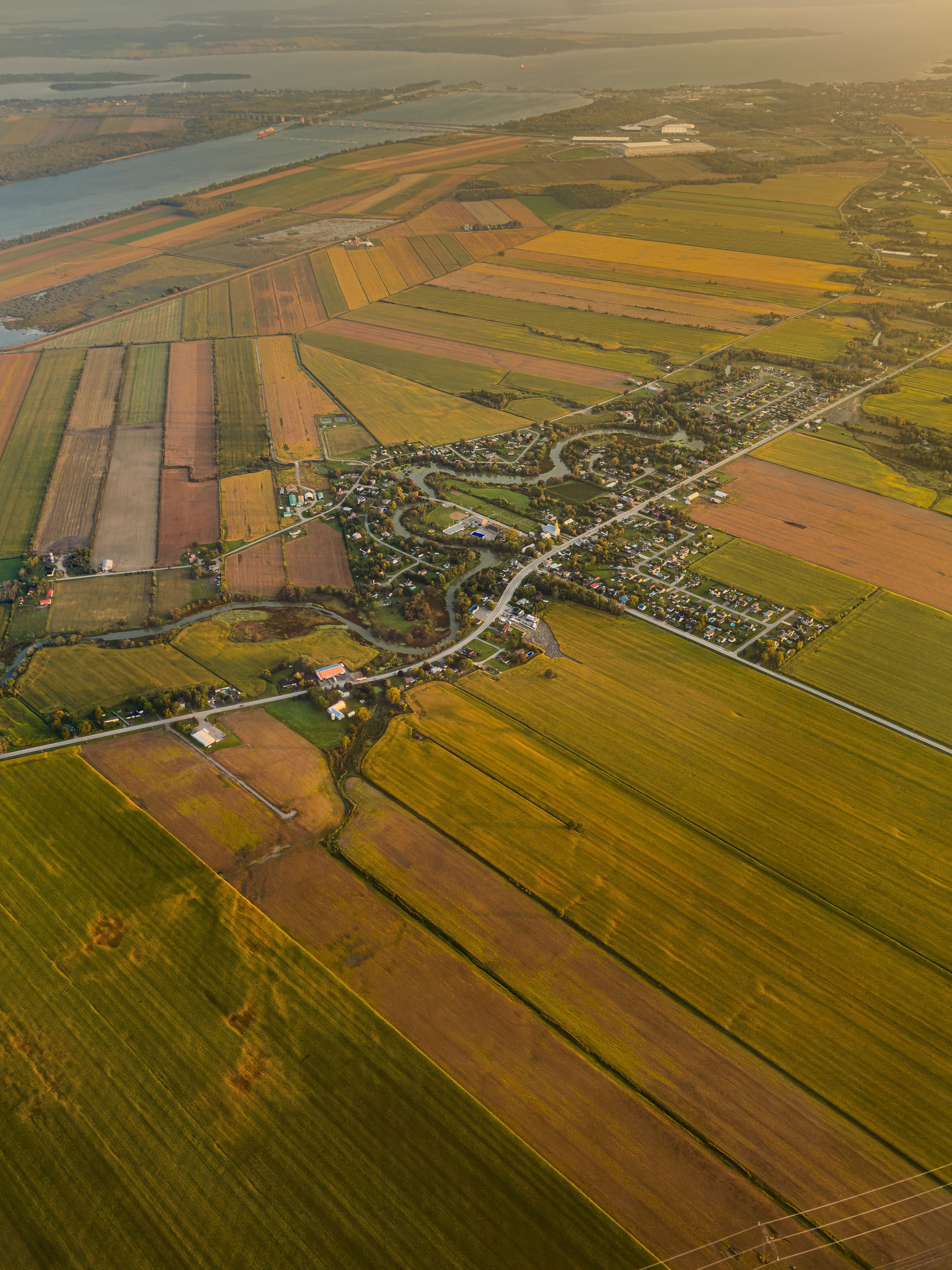 Field by the River Seen From Above · Free Stock Photo