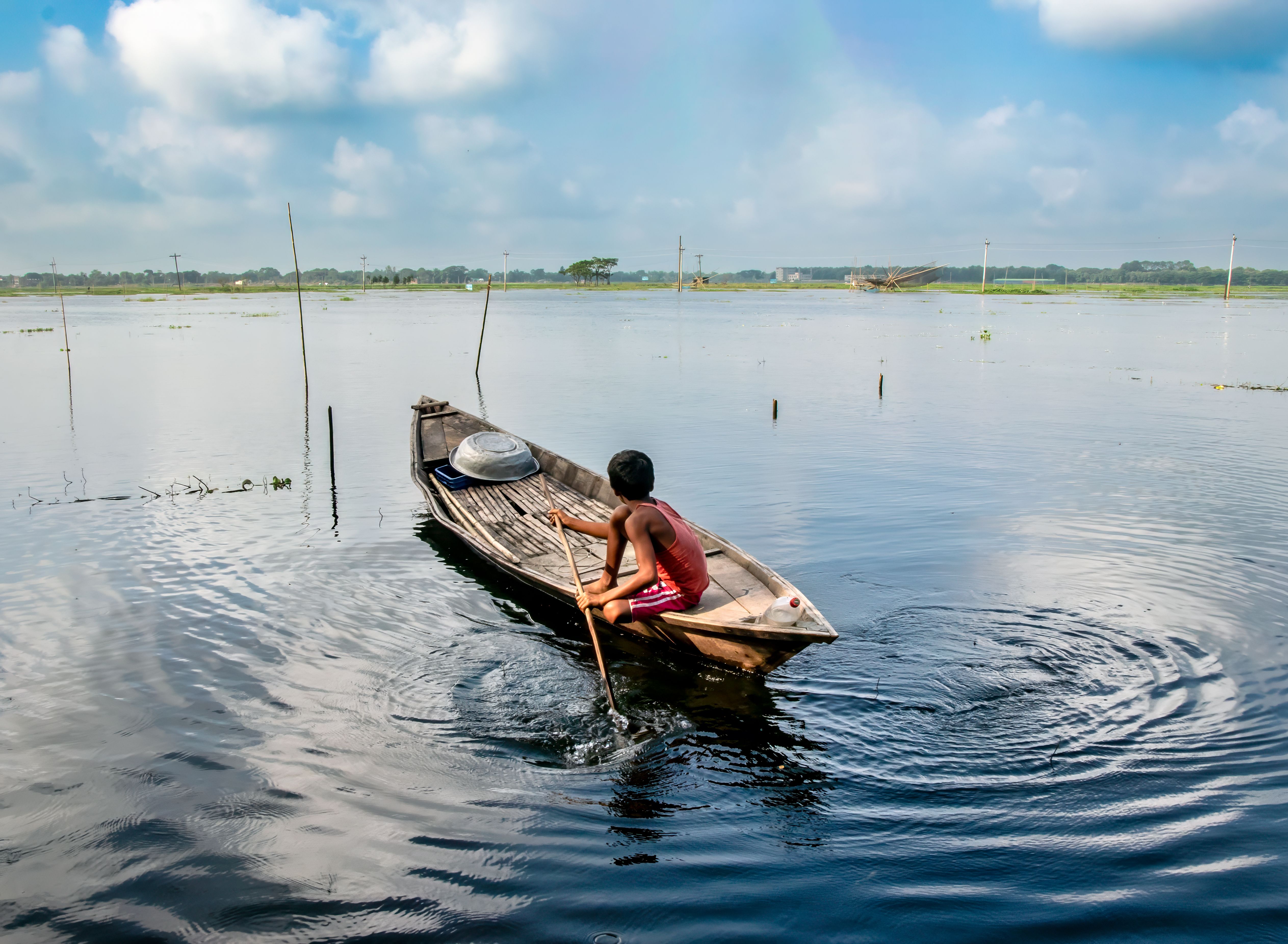 Boy Paddling on Lake · Free Stock Photo