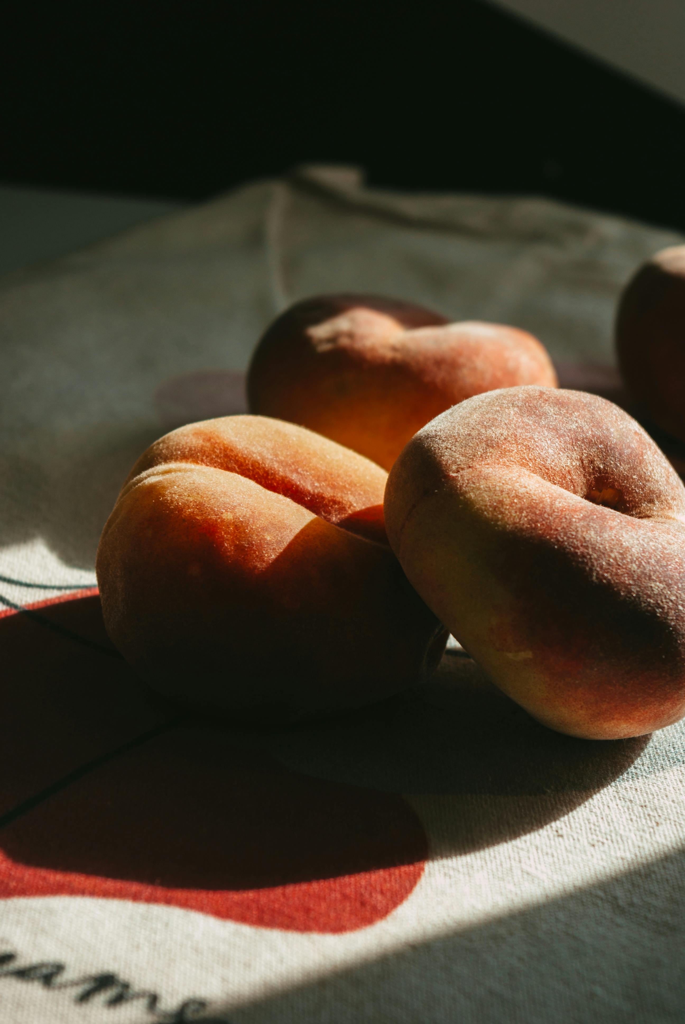A Close-Up Shot of a Peach on a Book · Free Stock Photo