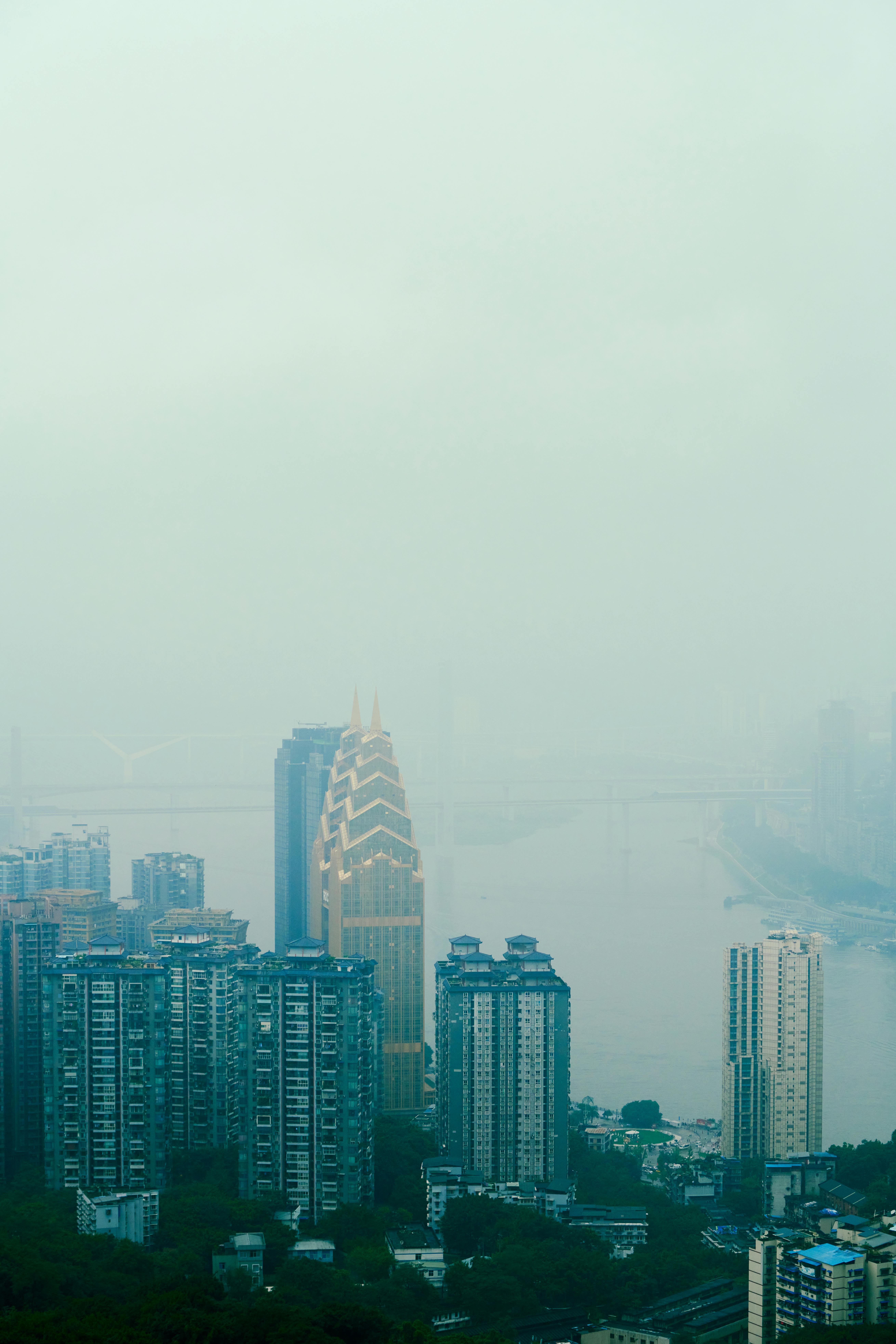 Low-angle Photography of Buildings Covered by Fog · Free Stock Photo