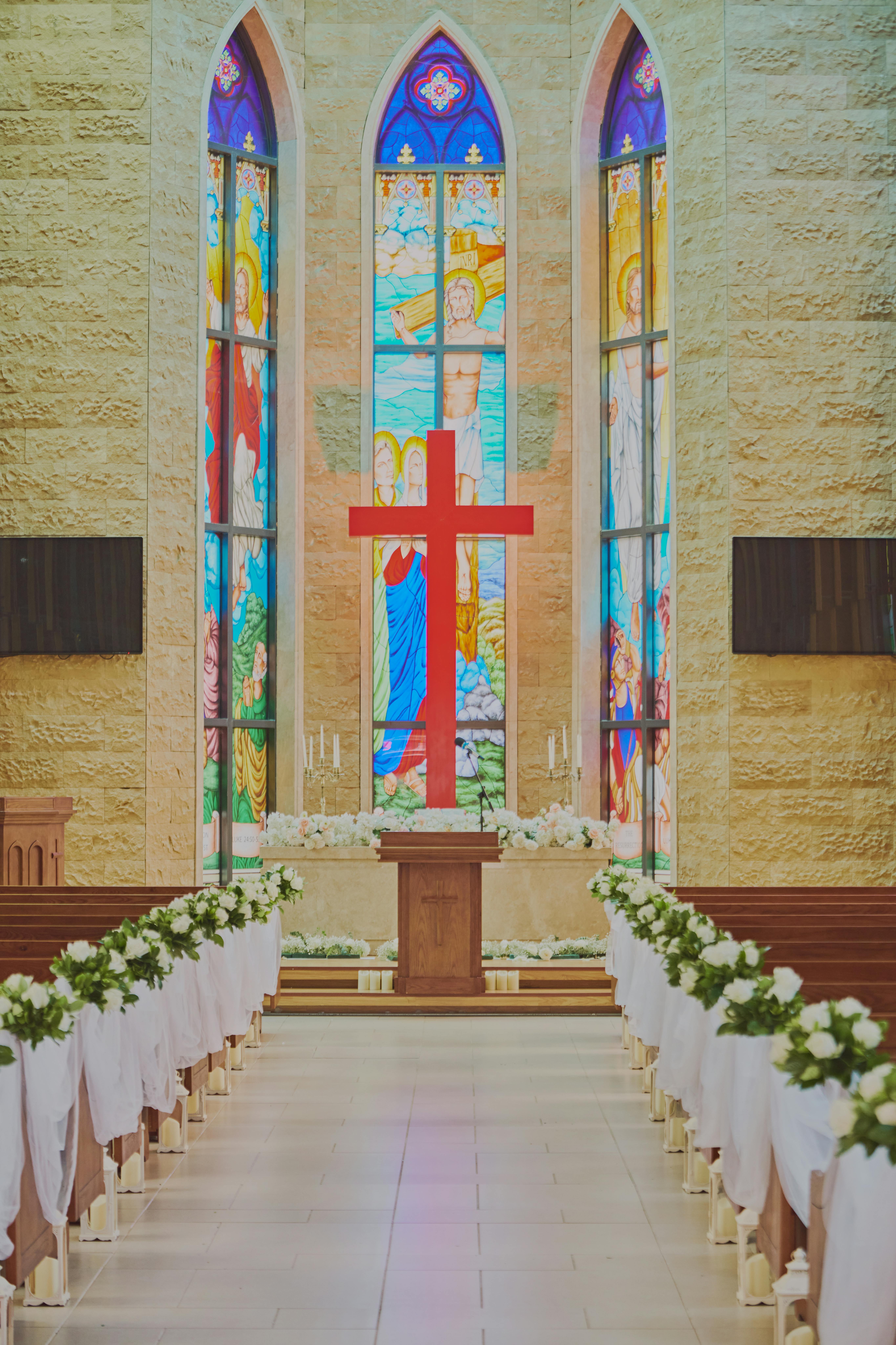 Colorful Stained Glass Windows Illuminating Church Aisle · Free Stock Photo