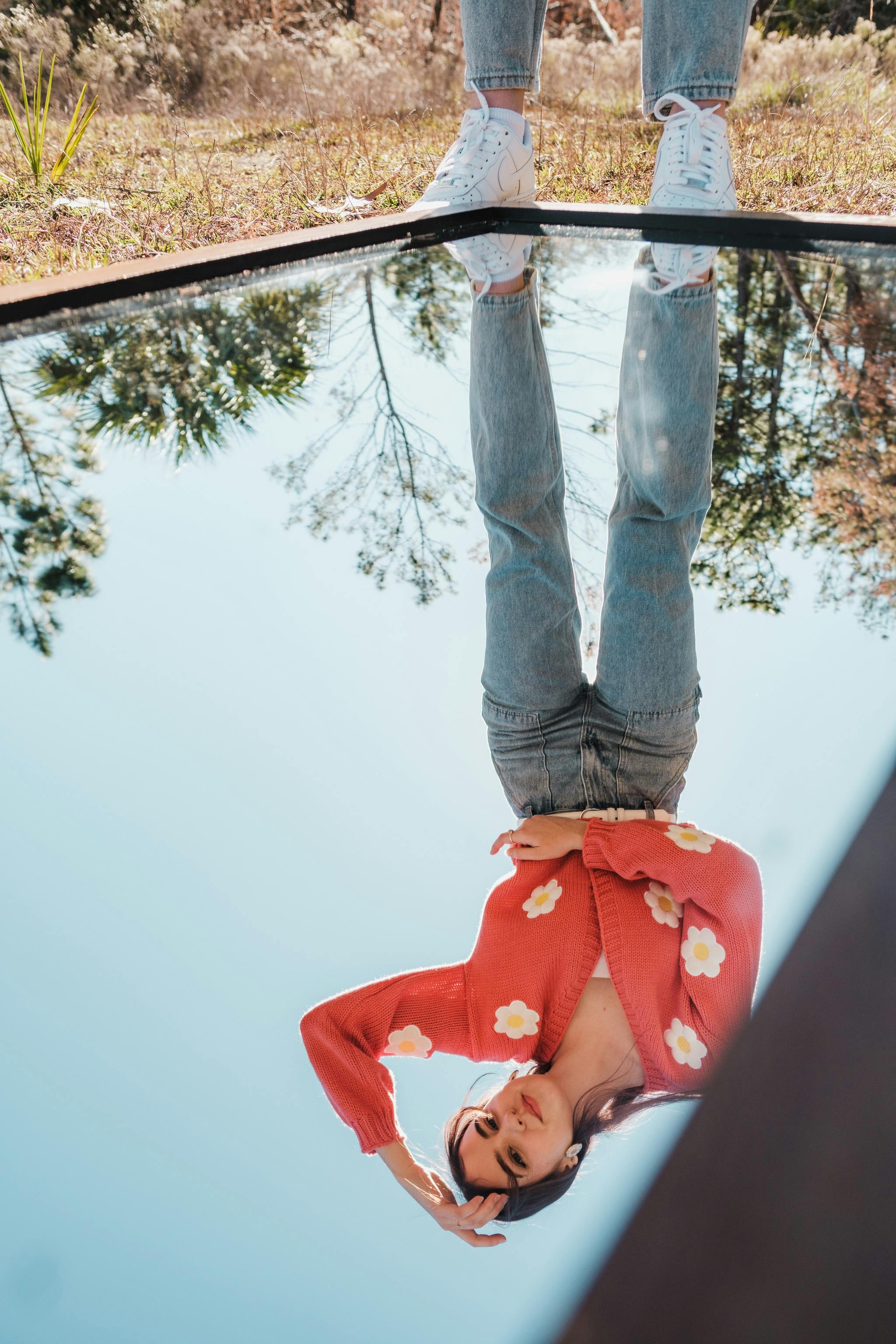 Reflection of a Woman in a Mirror Lying on the Ground · Free Stock Photo