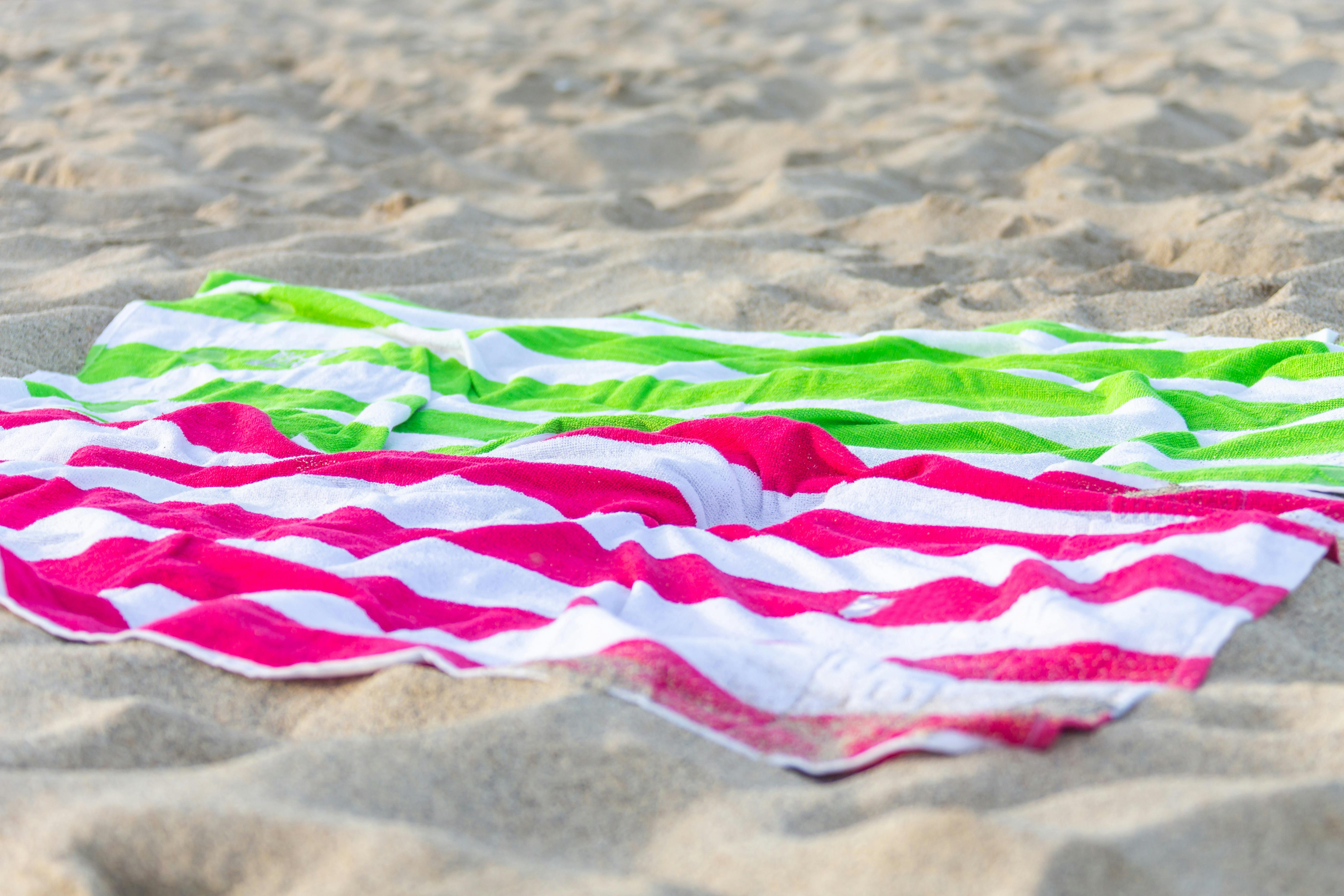 Striped Beach Towels on Sand · Free Stock Photo