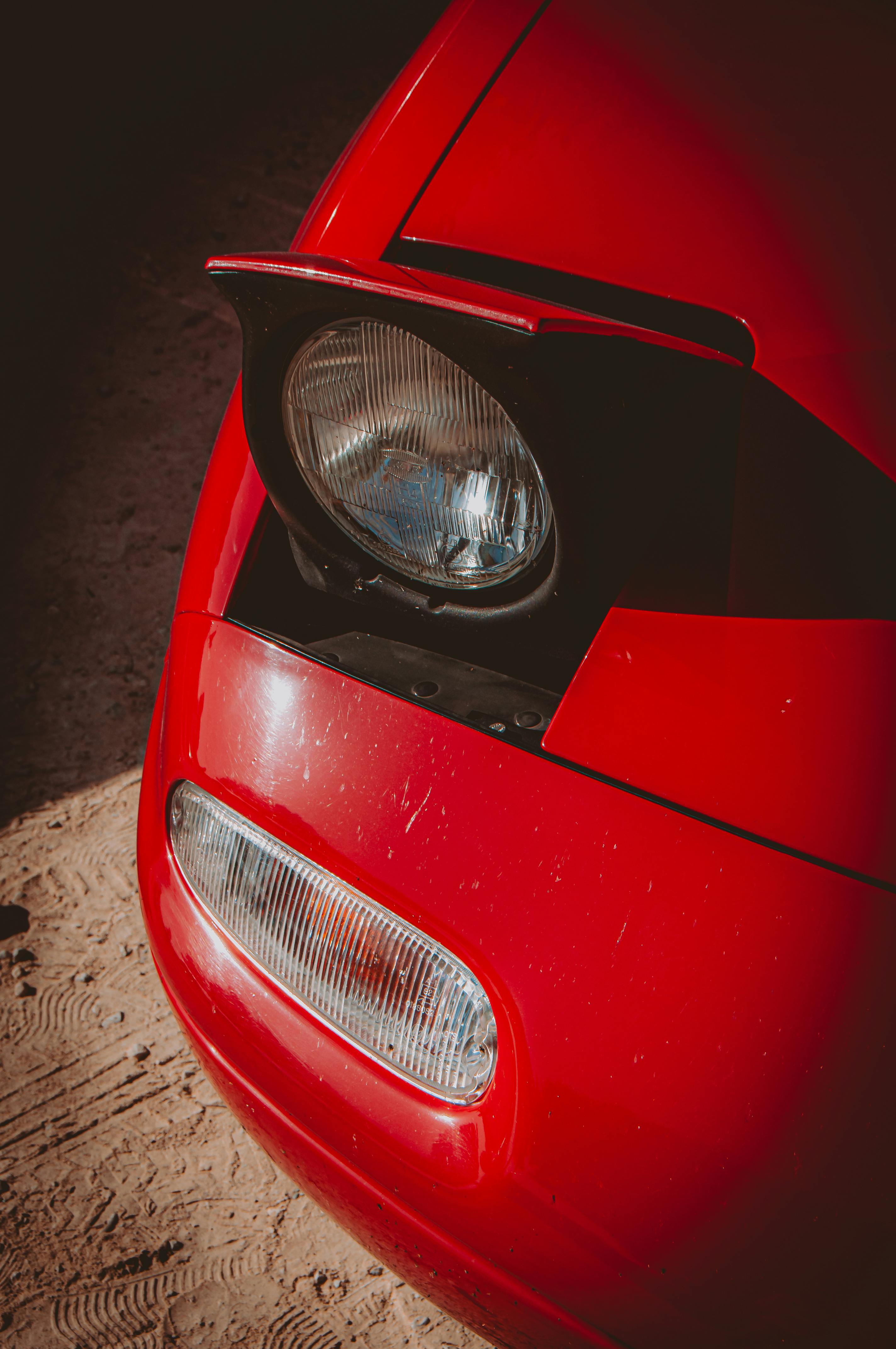 Pop Up Headlight of Red Car · Free Stock Photo